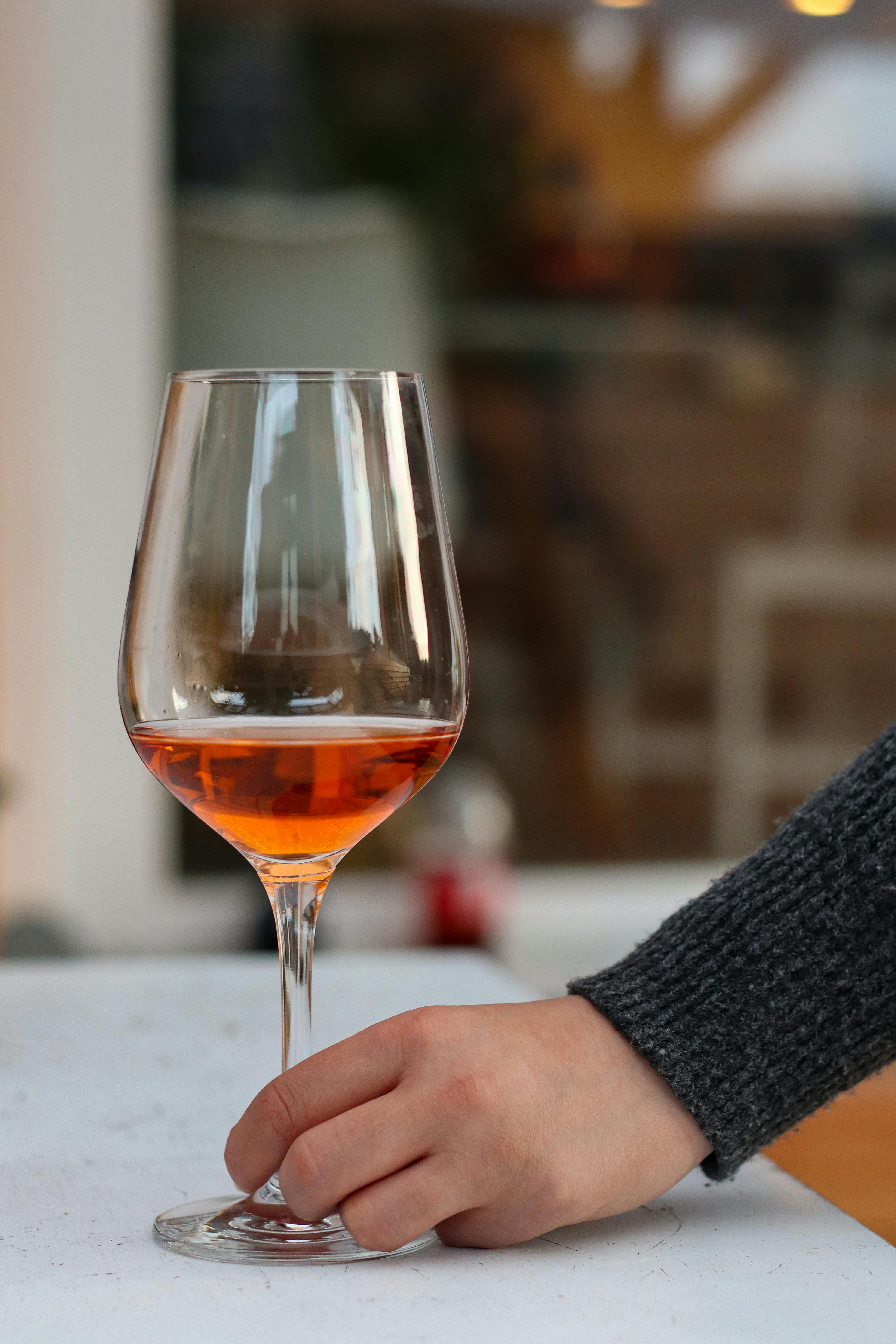 Hands Holding Glasses of Red Wine Having a Toast · Free Stock Photo