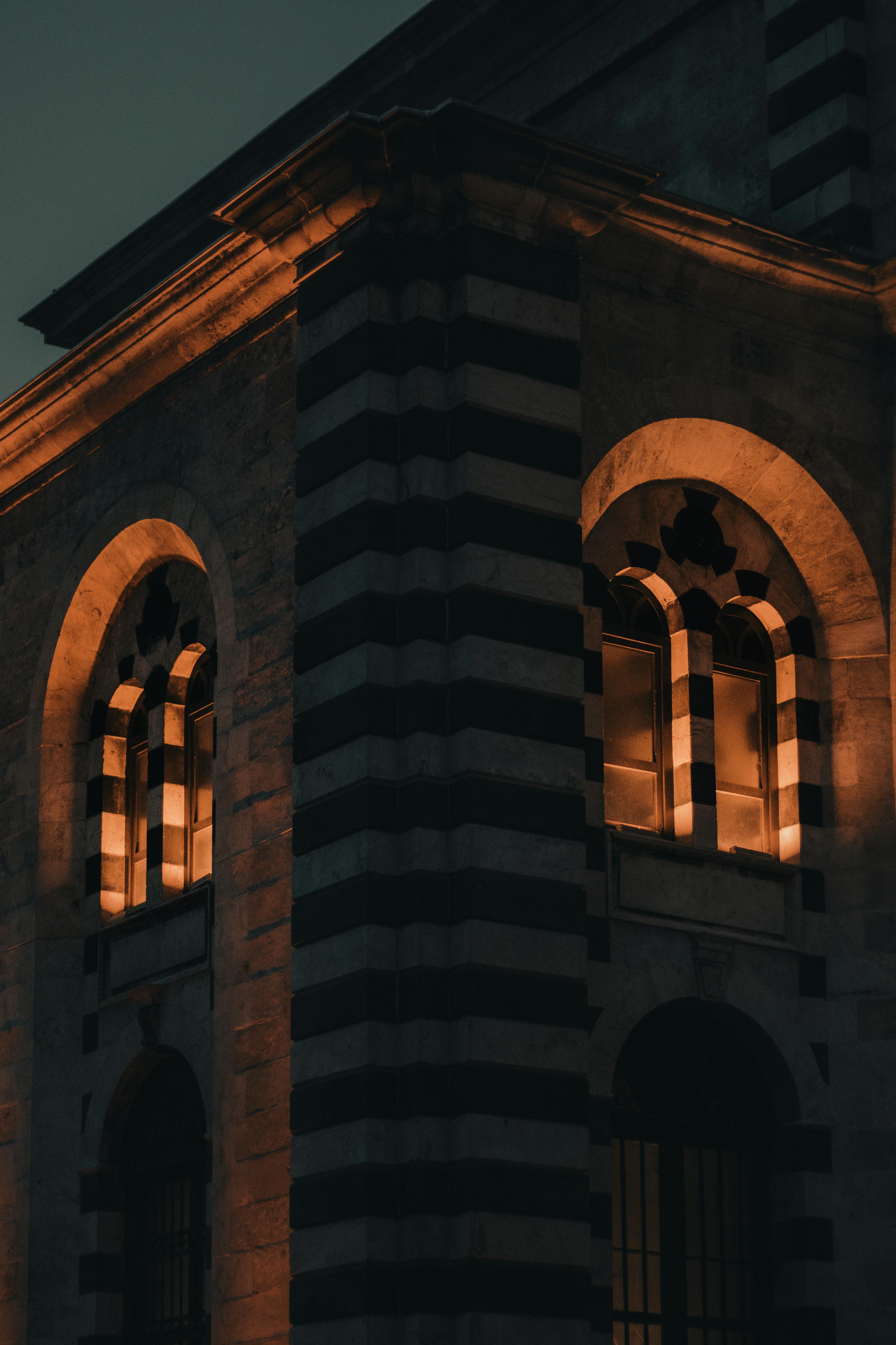 Photo of an Illuminated Building at Night · Free Stock Photo