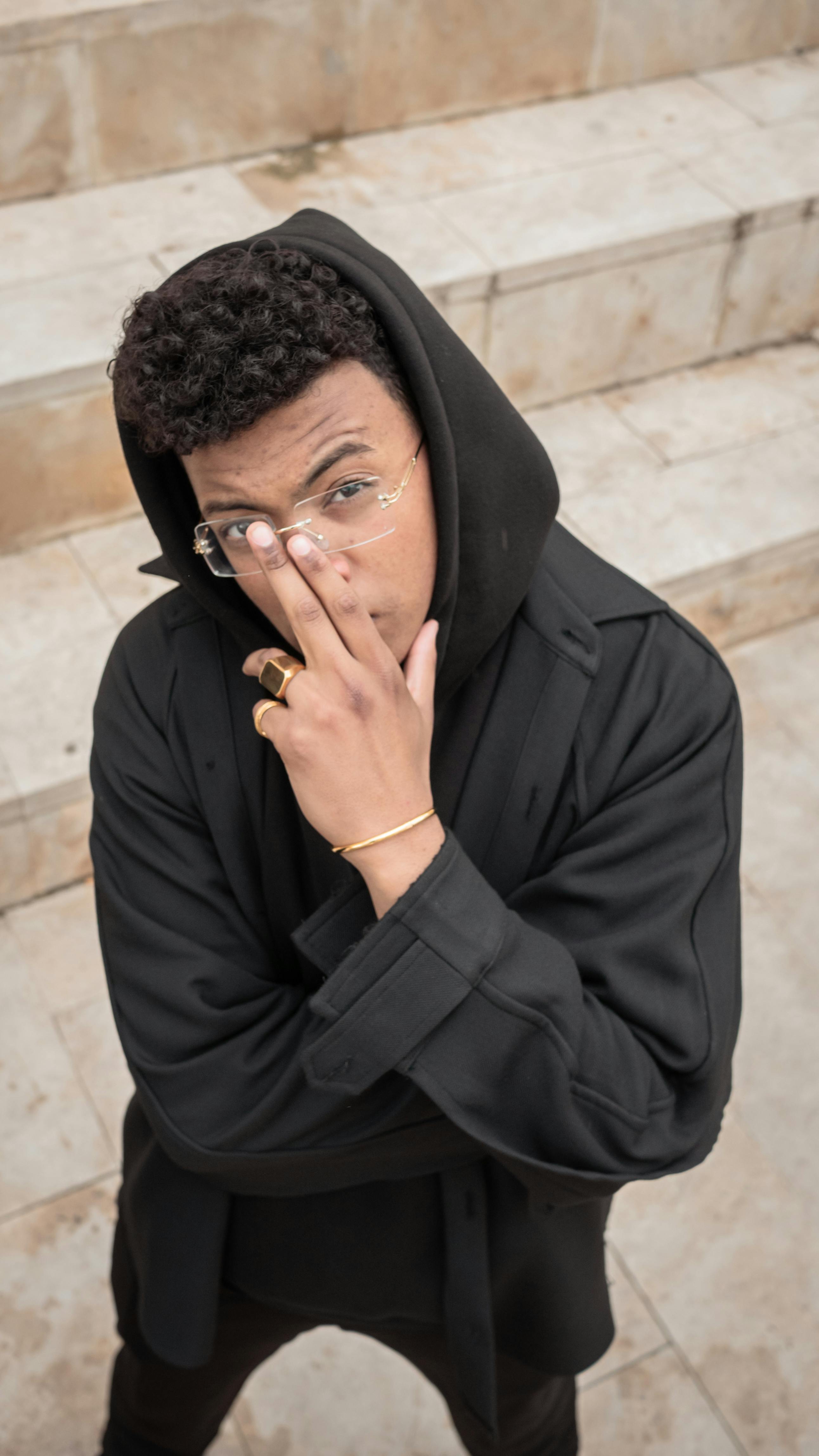 Man in Black Hoodie Covering His Face With His Hand · Free Stock Photo