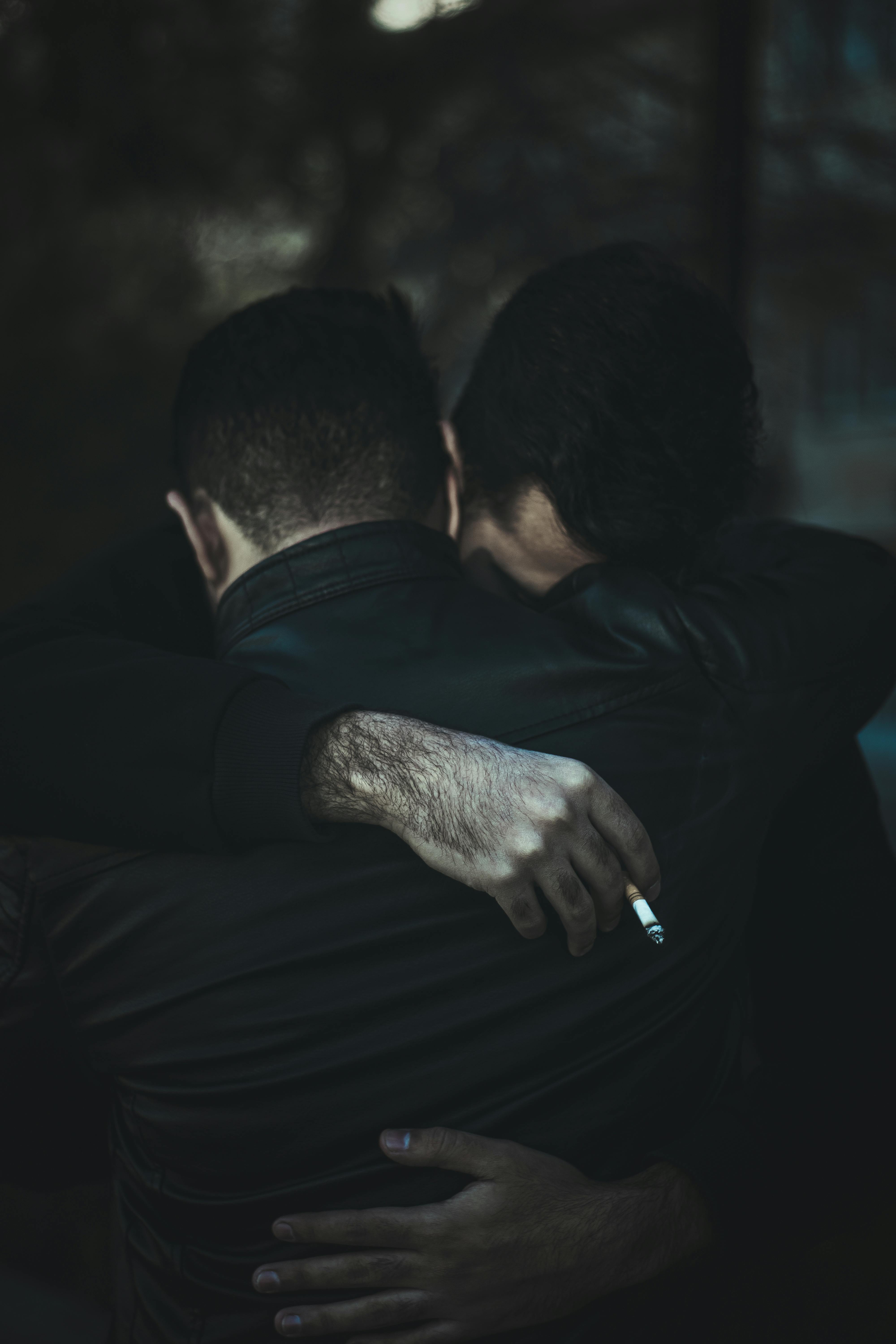 Unrecognizable men hugging and consoling each other · Free Stock Photo