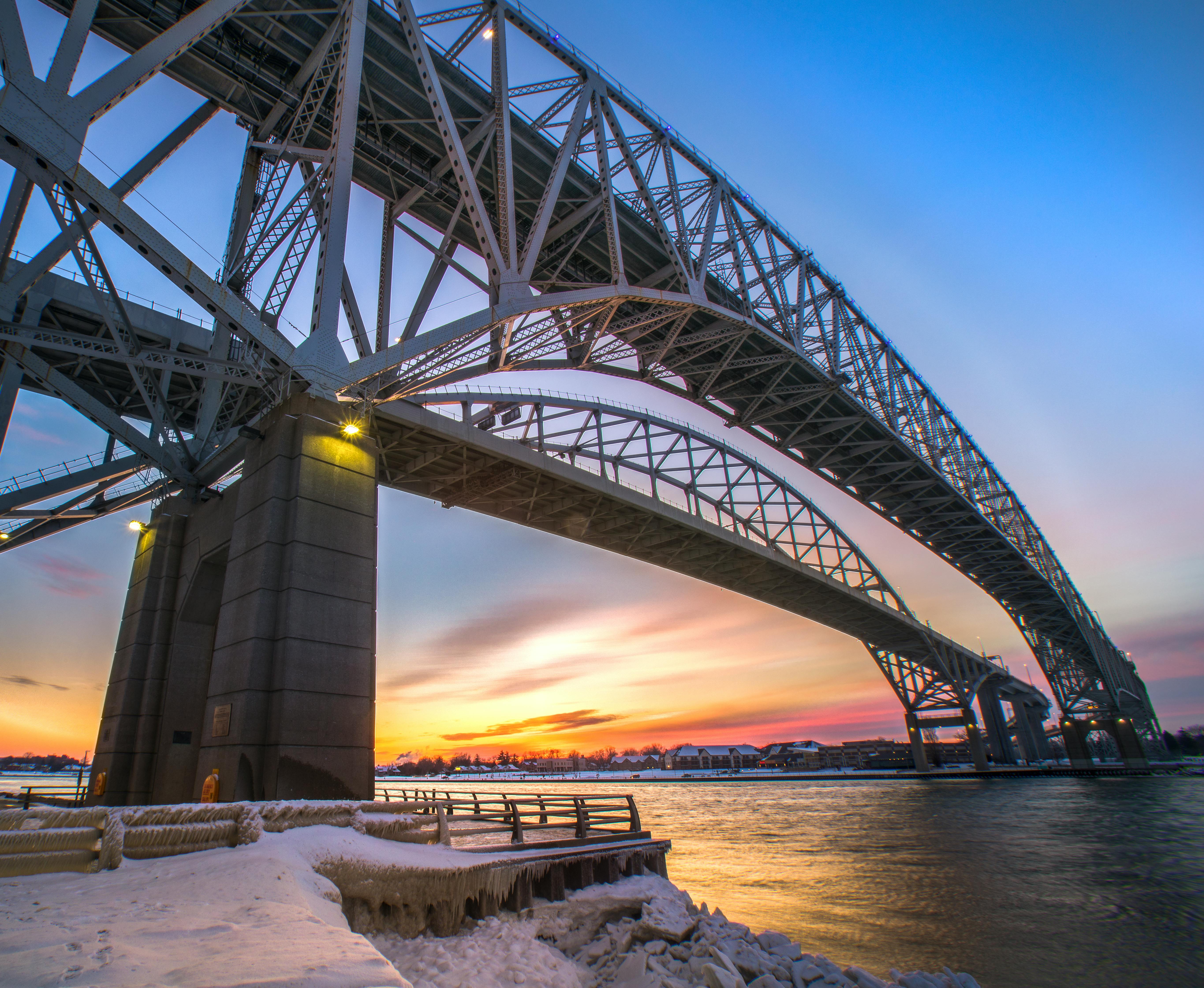 Low-Angle Shot of an Arch Bridge during Sunset · Free Stock Photo
