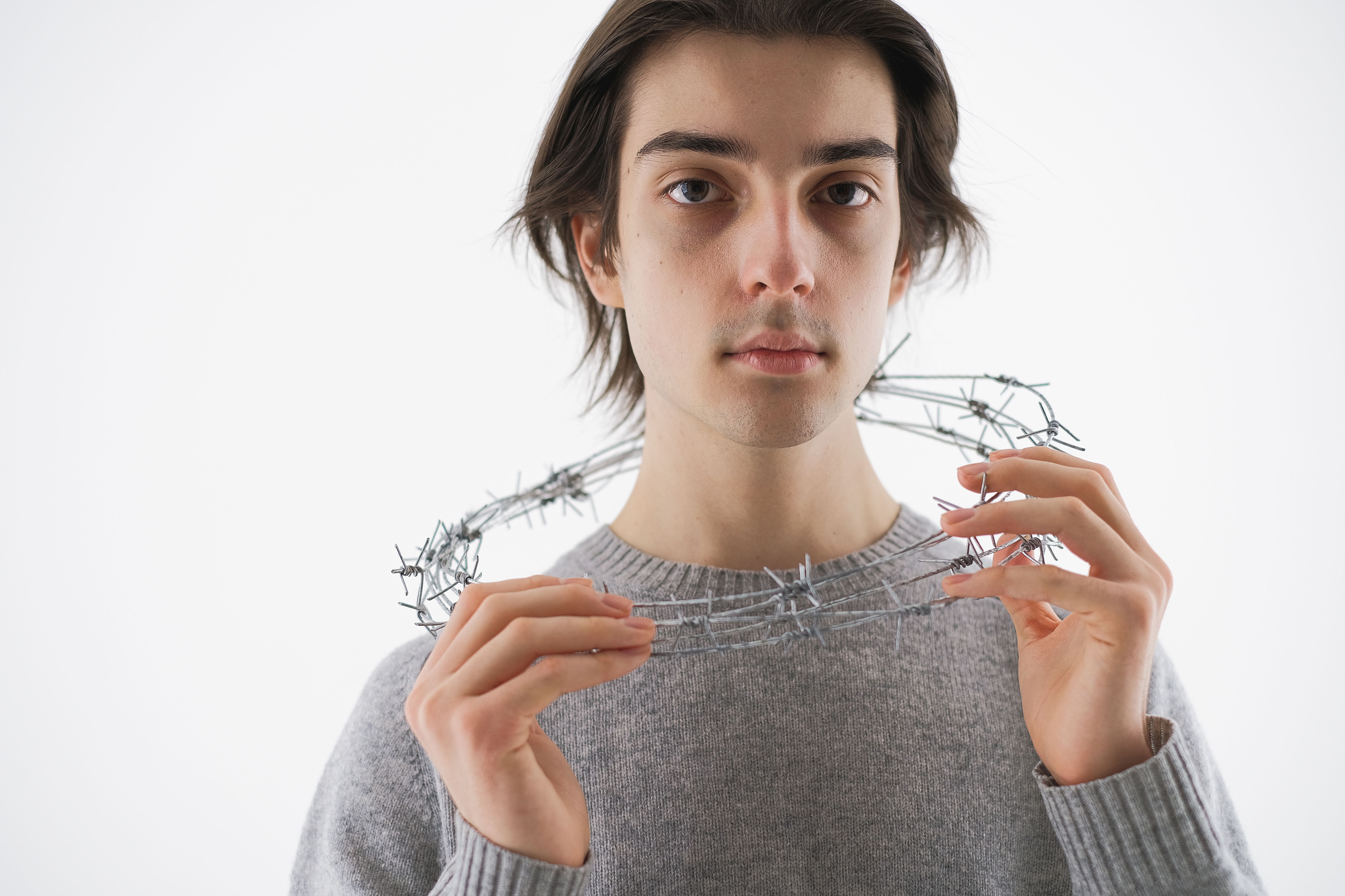 A Person Holding the Barbed Wire · Free Stock Photo