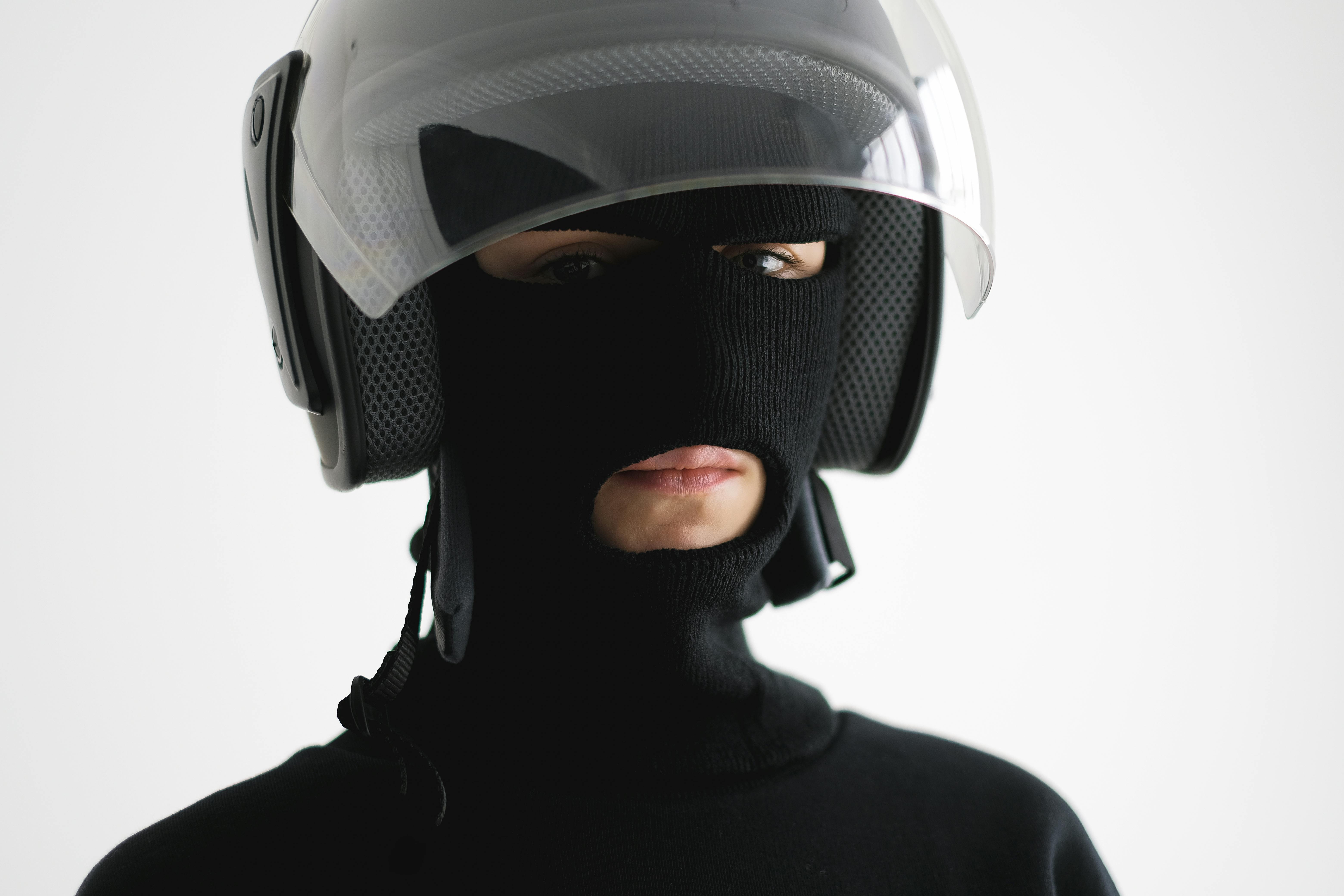 Men Wearing a Motorcycle Helmets Standing on a Field · Free Stock Photo
