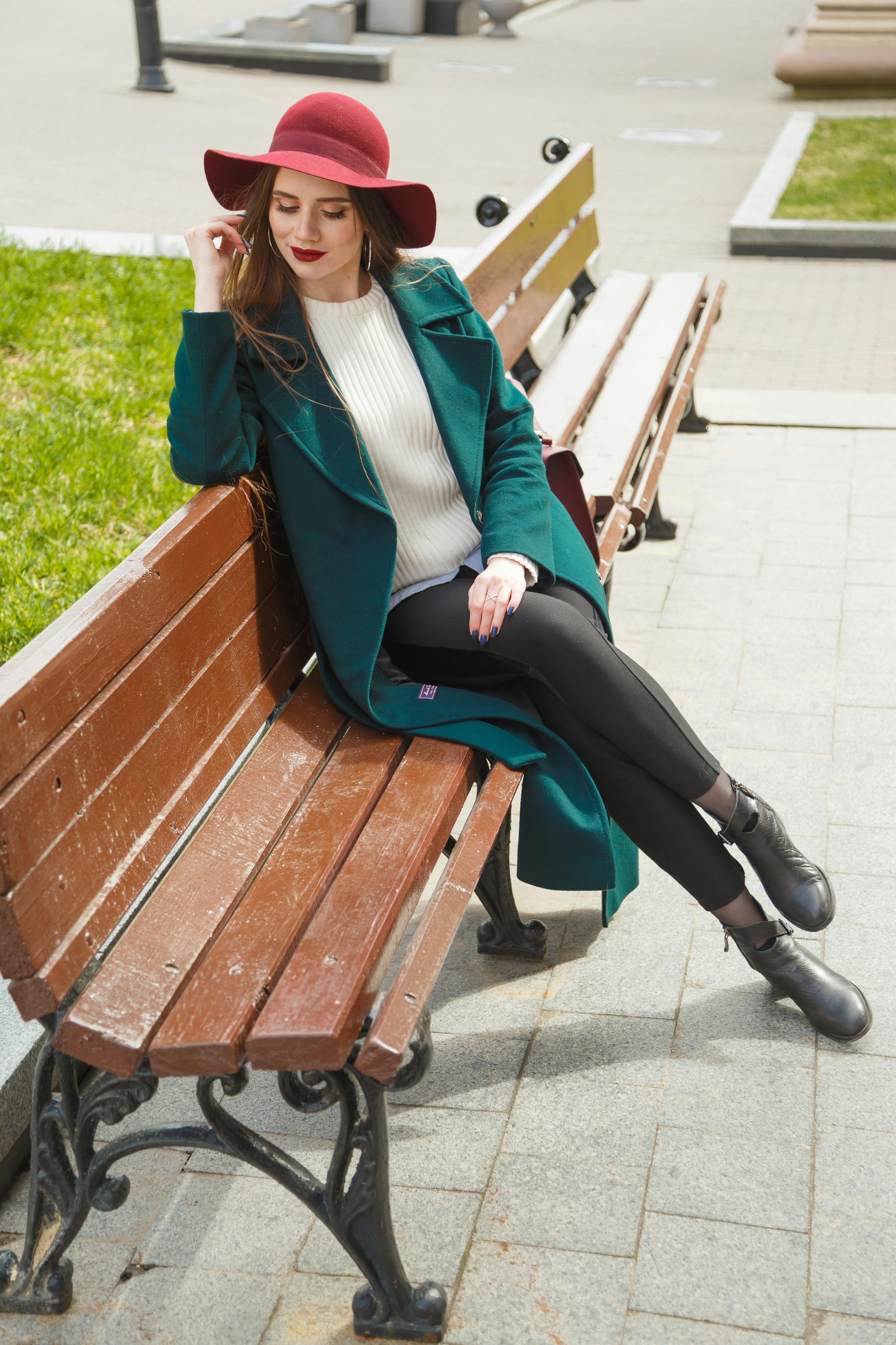 Smiling Woman Sitting On Bench · Free Stock Photo