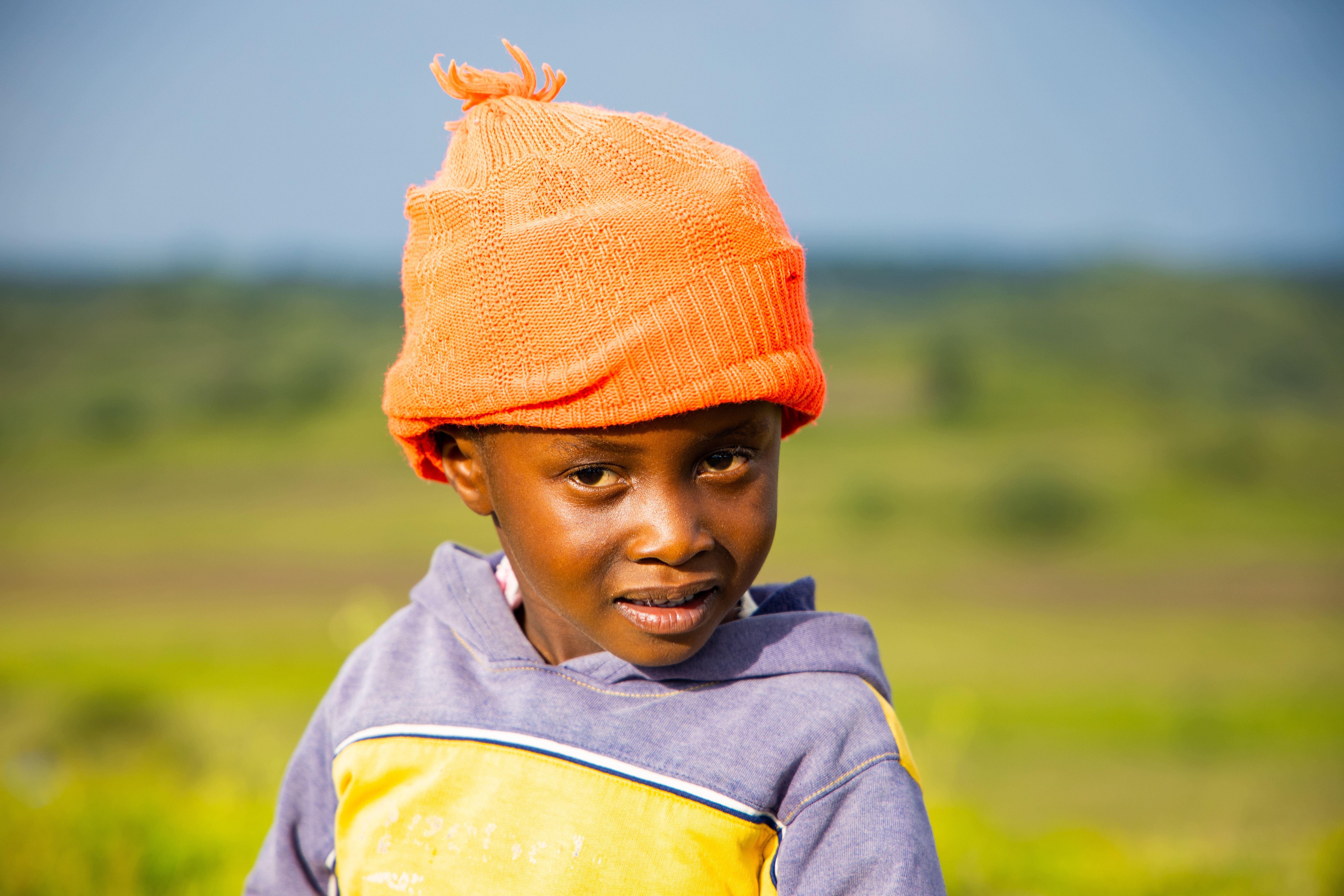 A Young Boy Wearing Orange Beanie · Free Stock Photo
