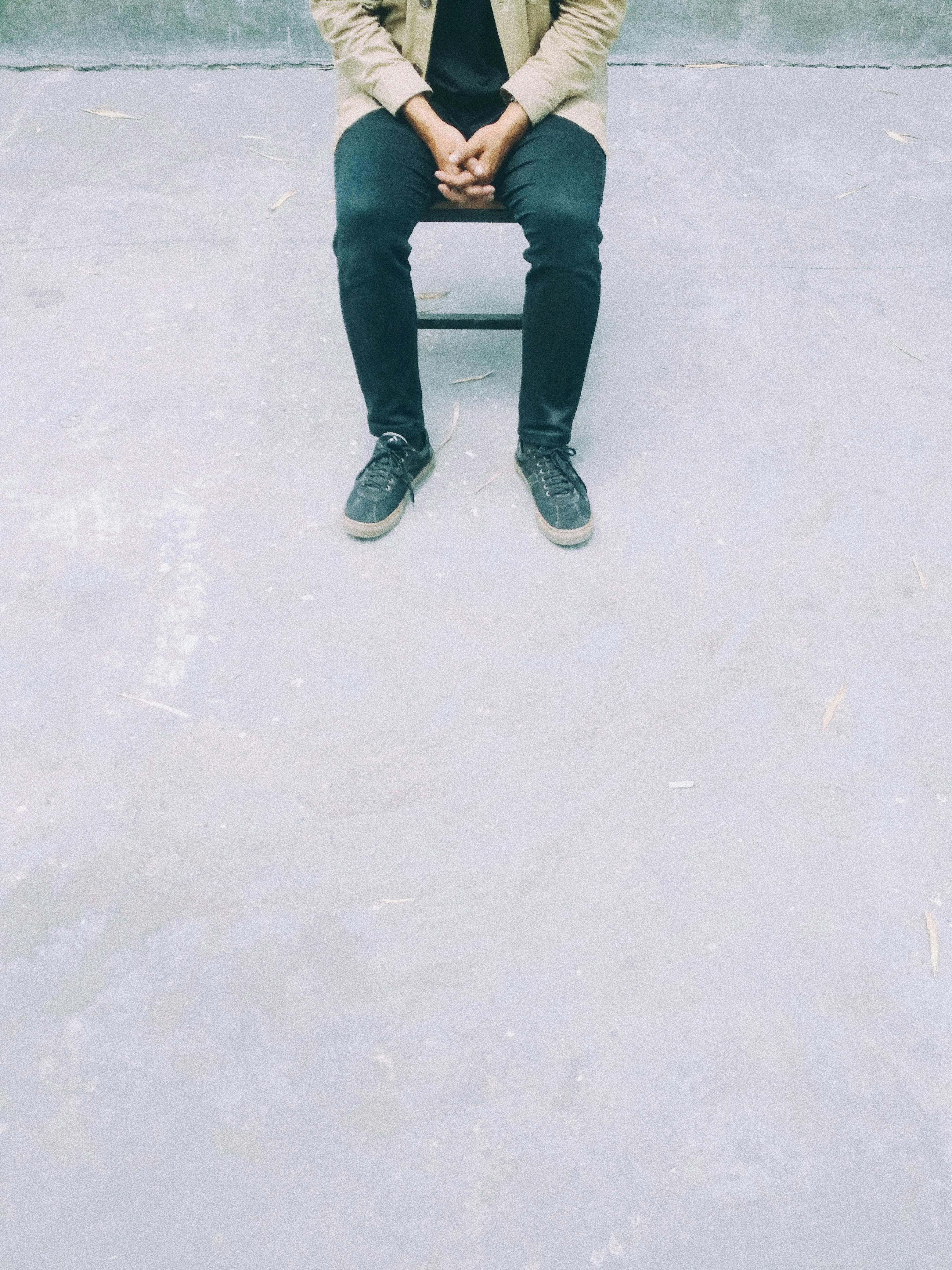 A Person Sitting on a Chair · Free Stock Photo