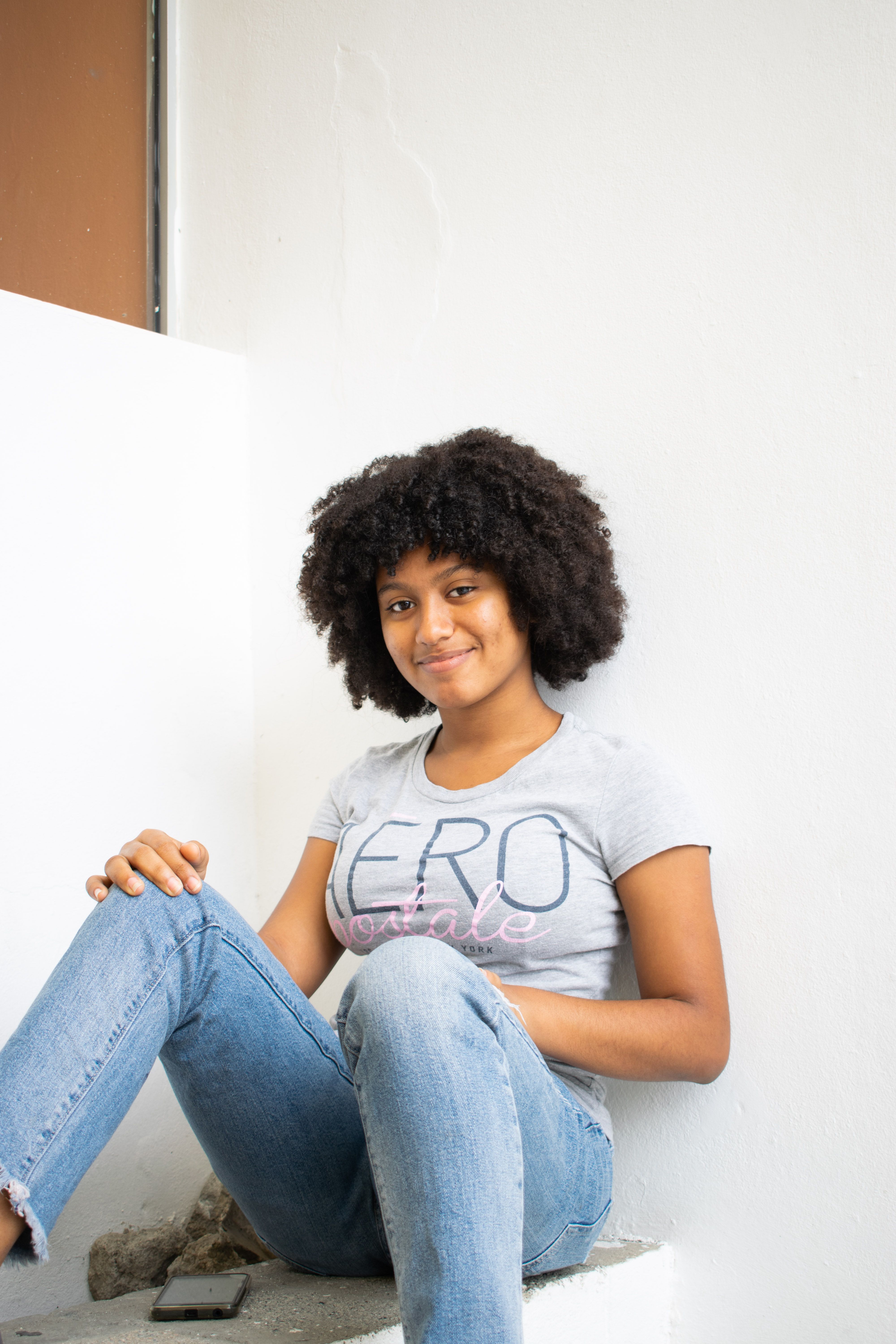 A Woman Covering Her Chest with Crossed Arms · Free Stock Photo