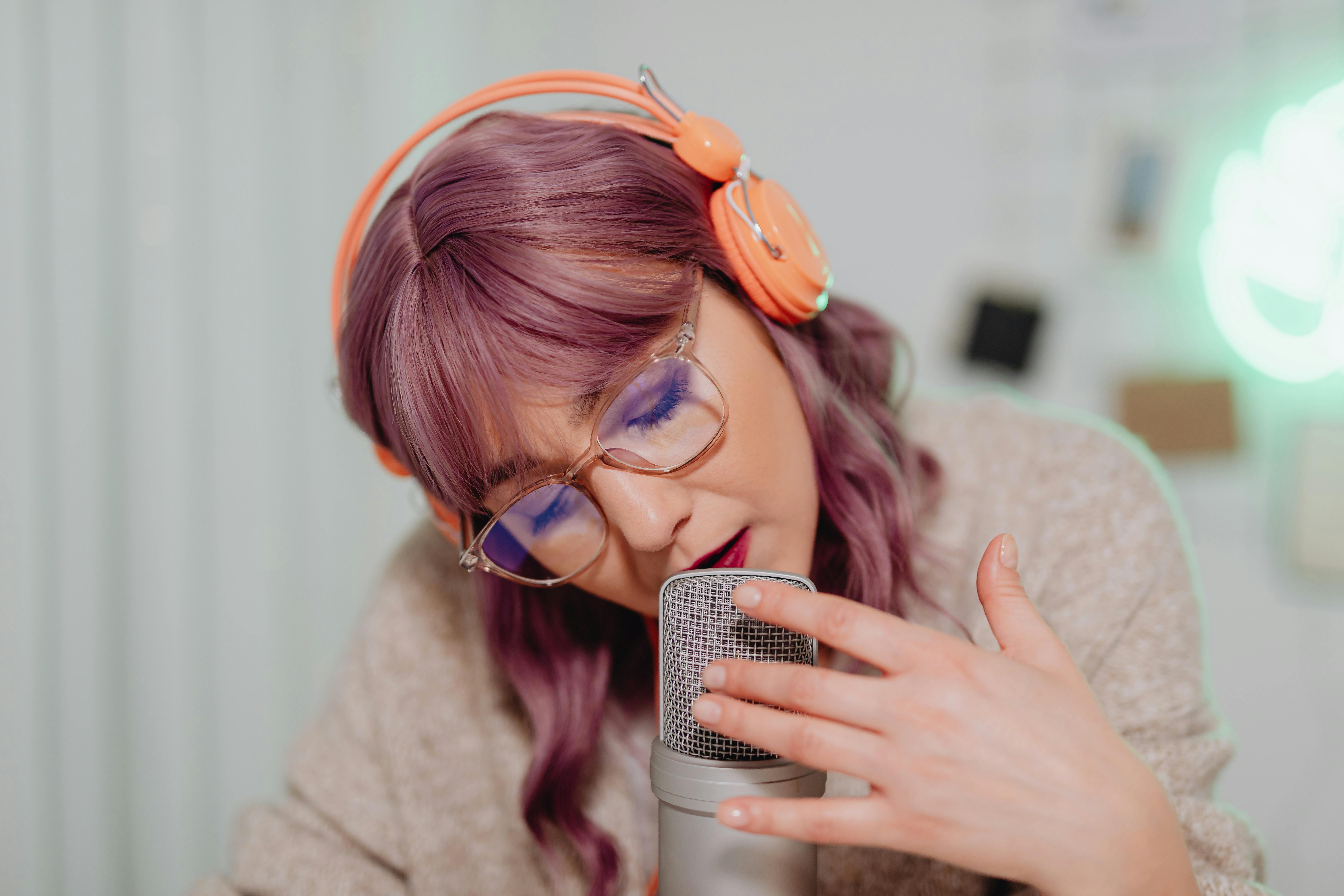 Person Using Microphone · Free Stock Photo