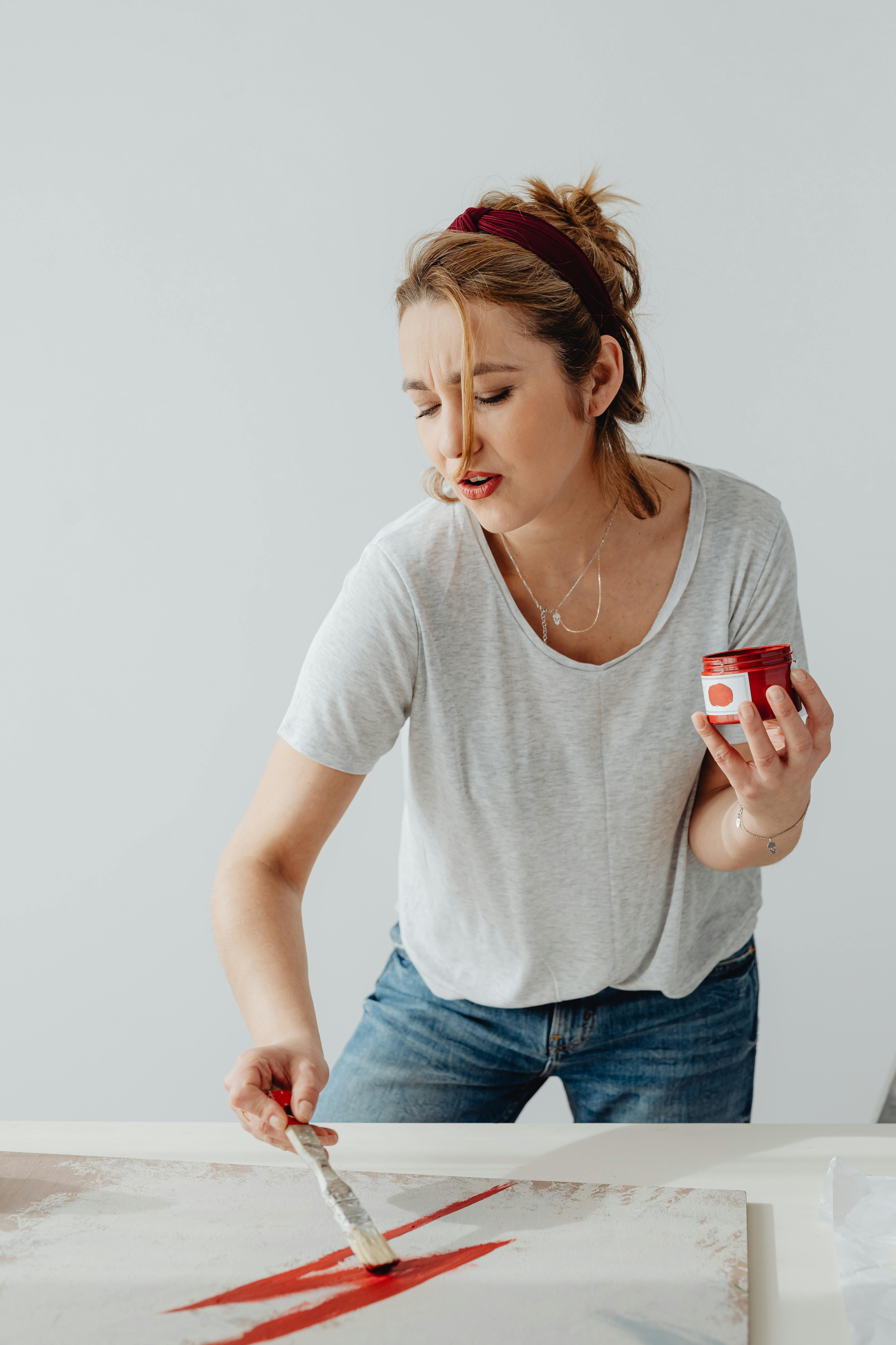 Woman Painting on Wall · Free Stock Photo