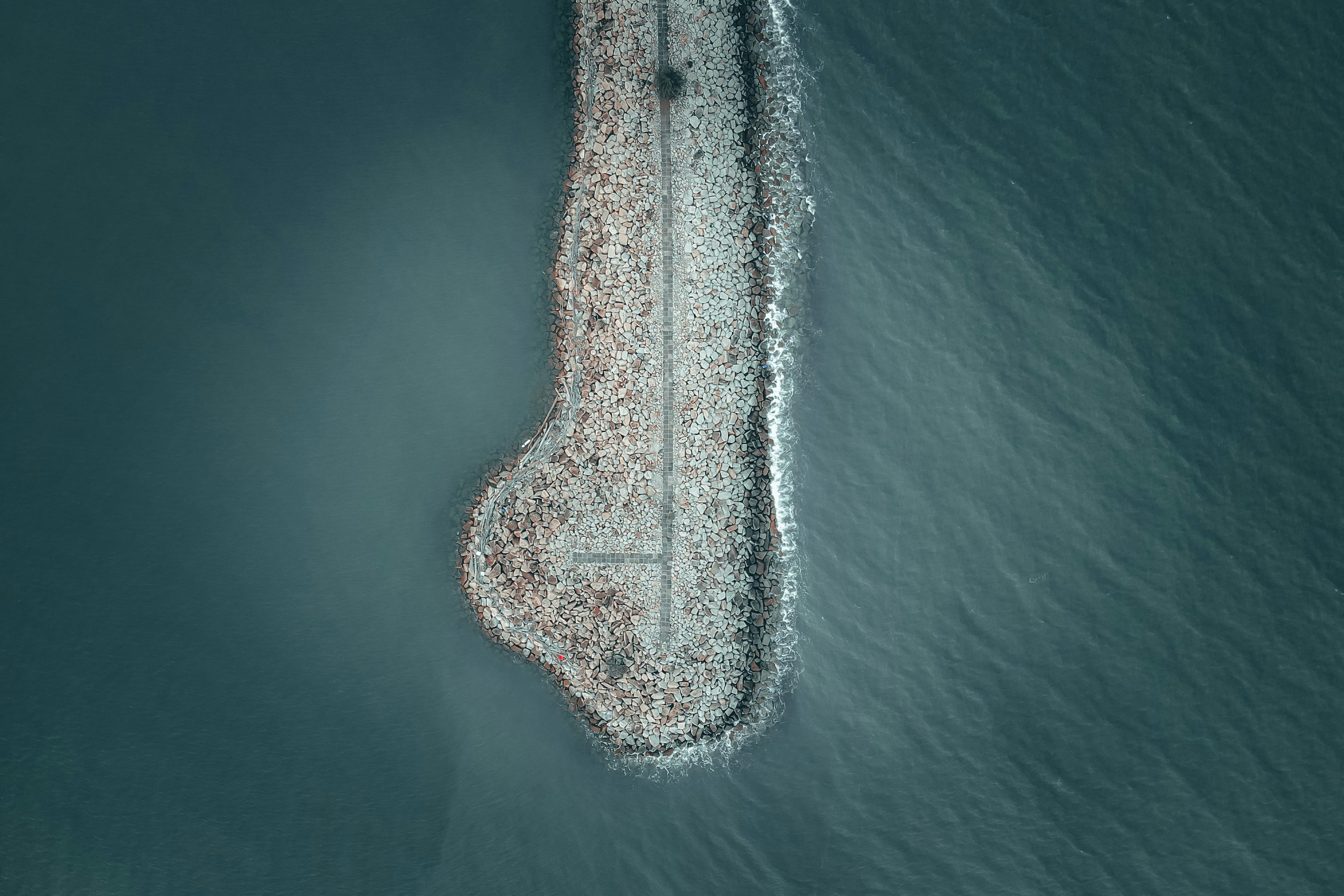 Footpath with wooden railings leading to sea · Free Stock Photo
