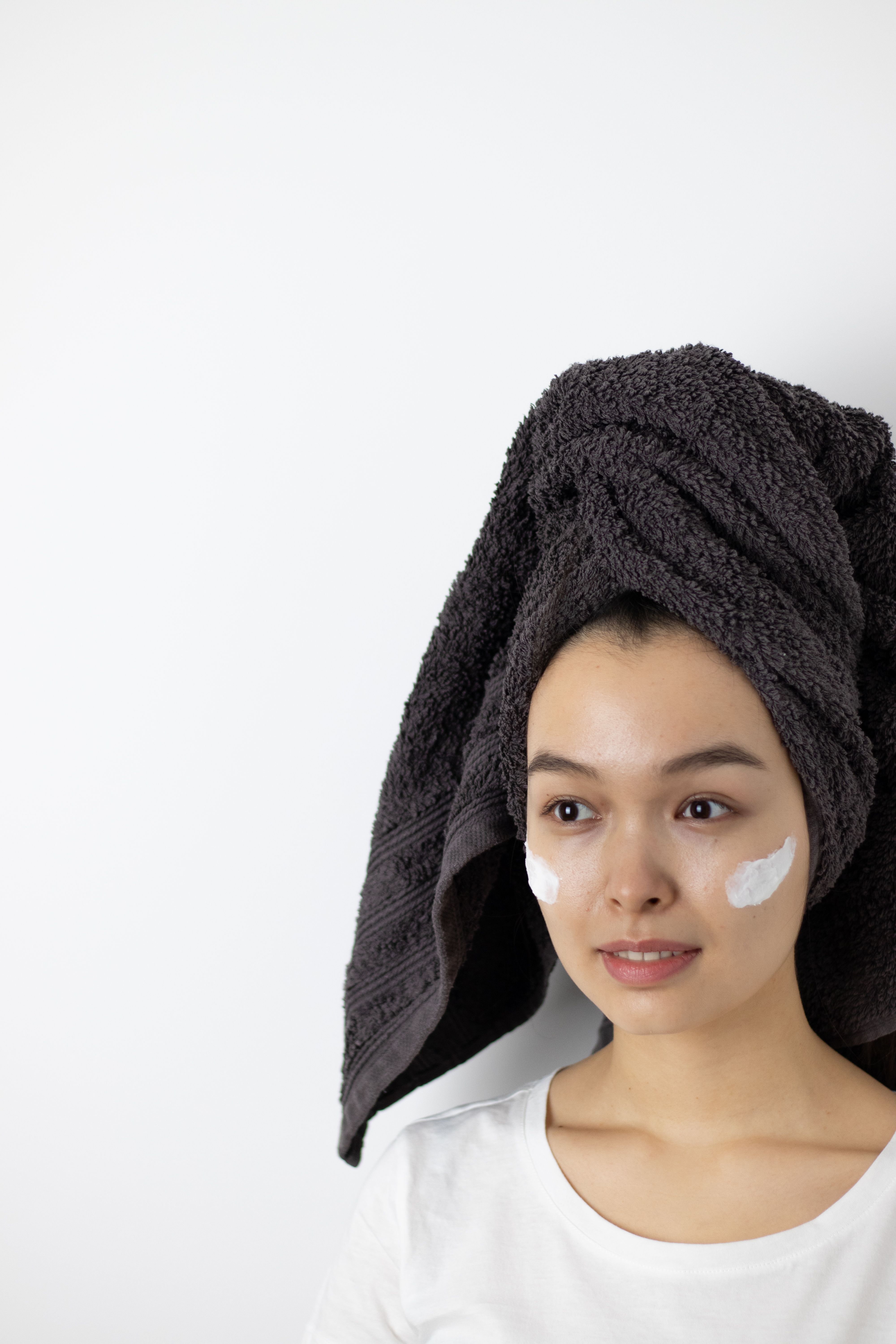 A Woman with a Skin Care Product on Her Face · Free Stock Photo