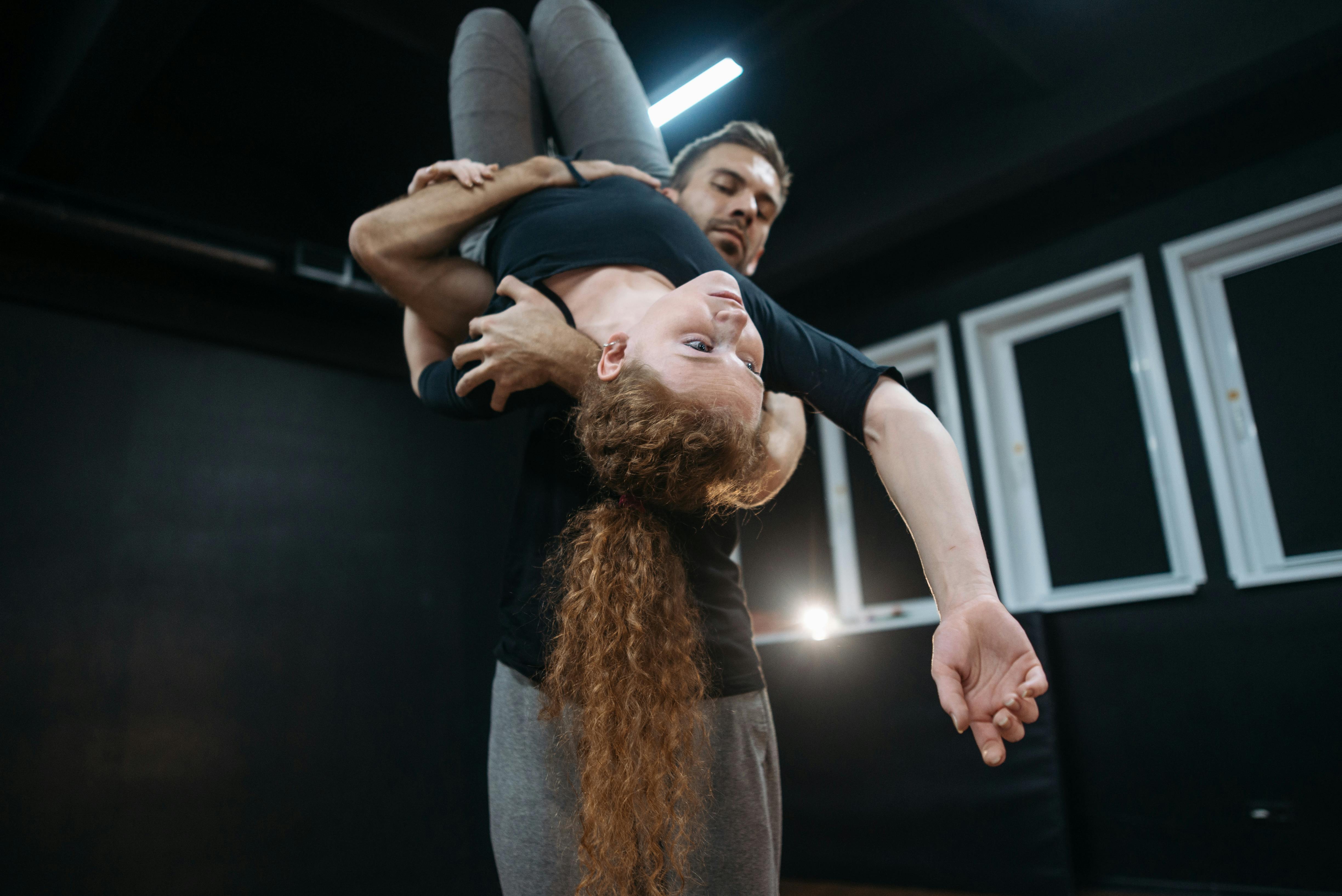 Man Carrying a Woman on his Shoulder in a Dance · Free Stock Photo