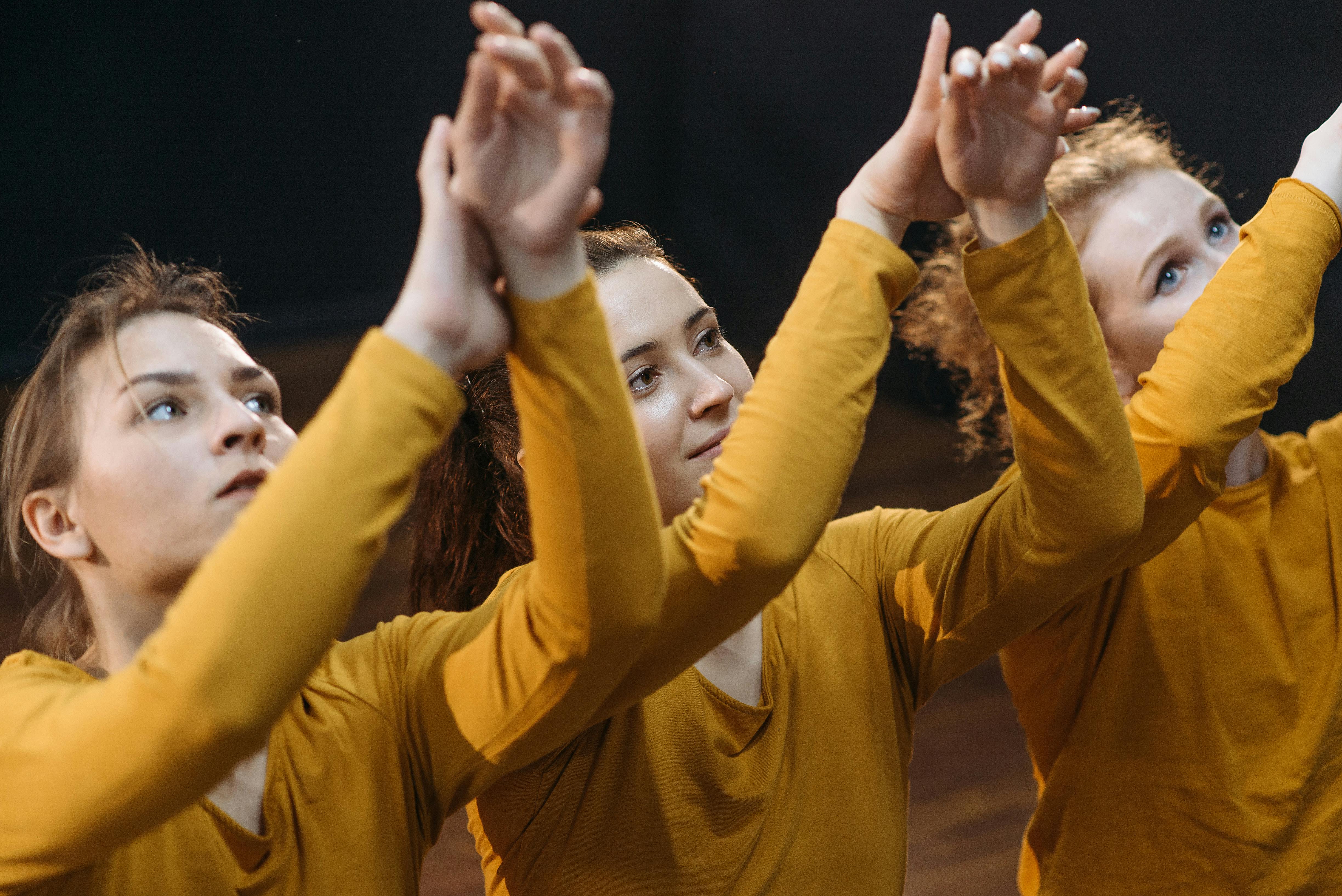Women in Yellow Long Sleeved Shirts Dancing · Free Stock Photo