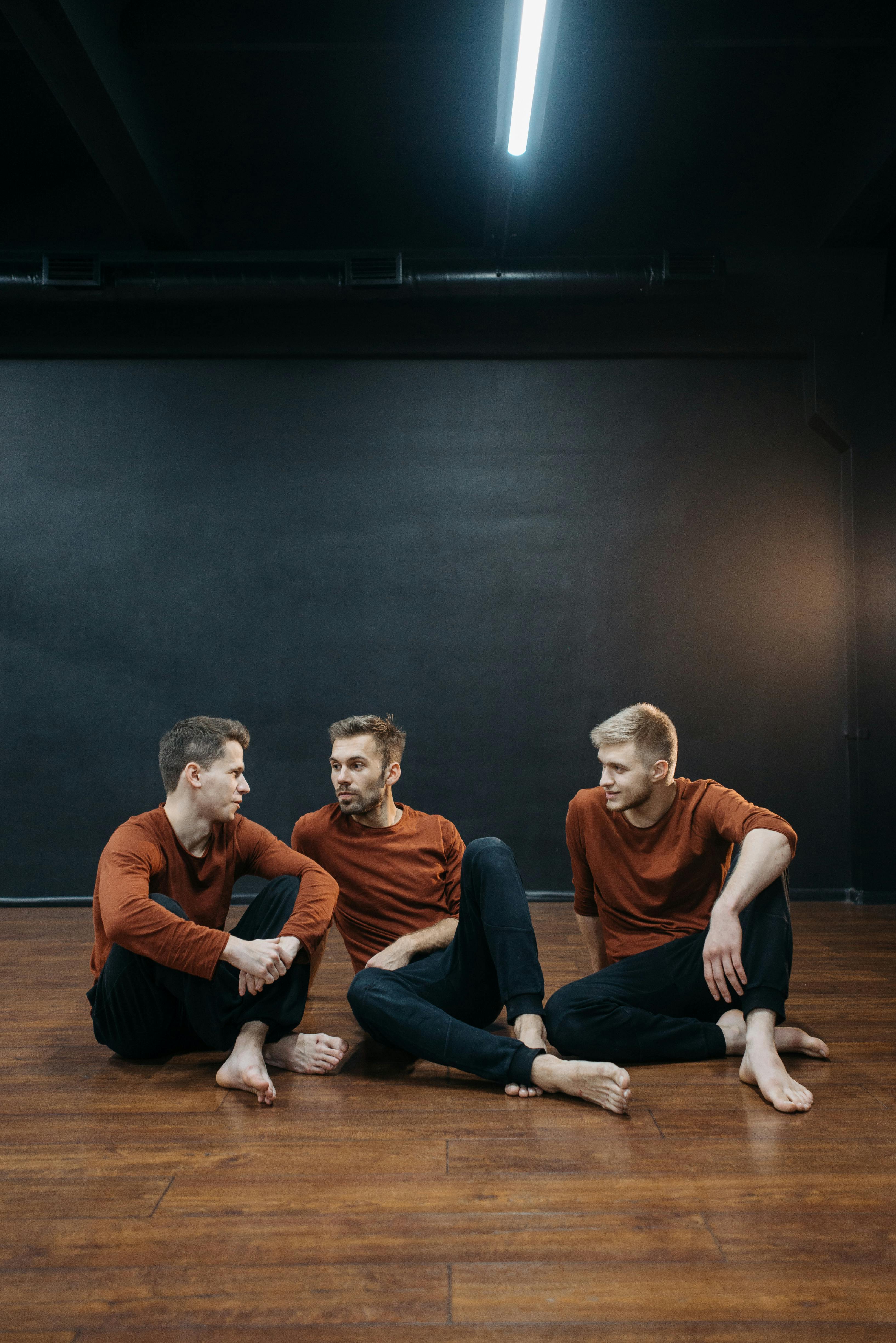 Men Wearing Matching Outfits Talking · Free Stock Photo