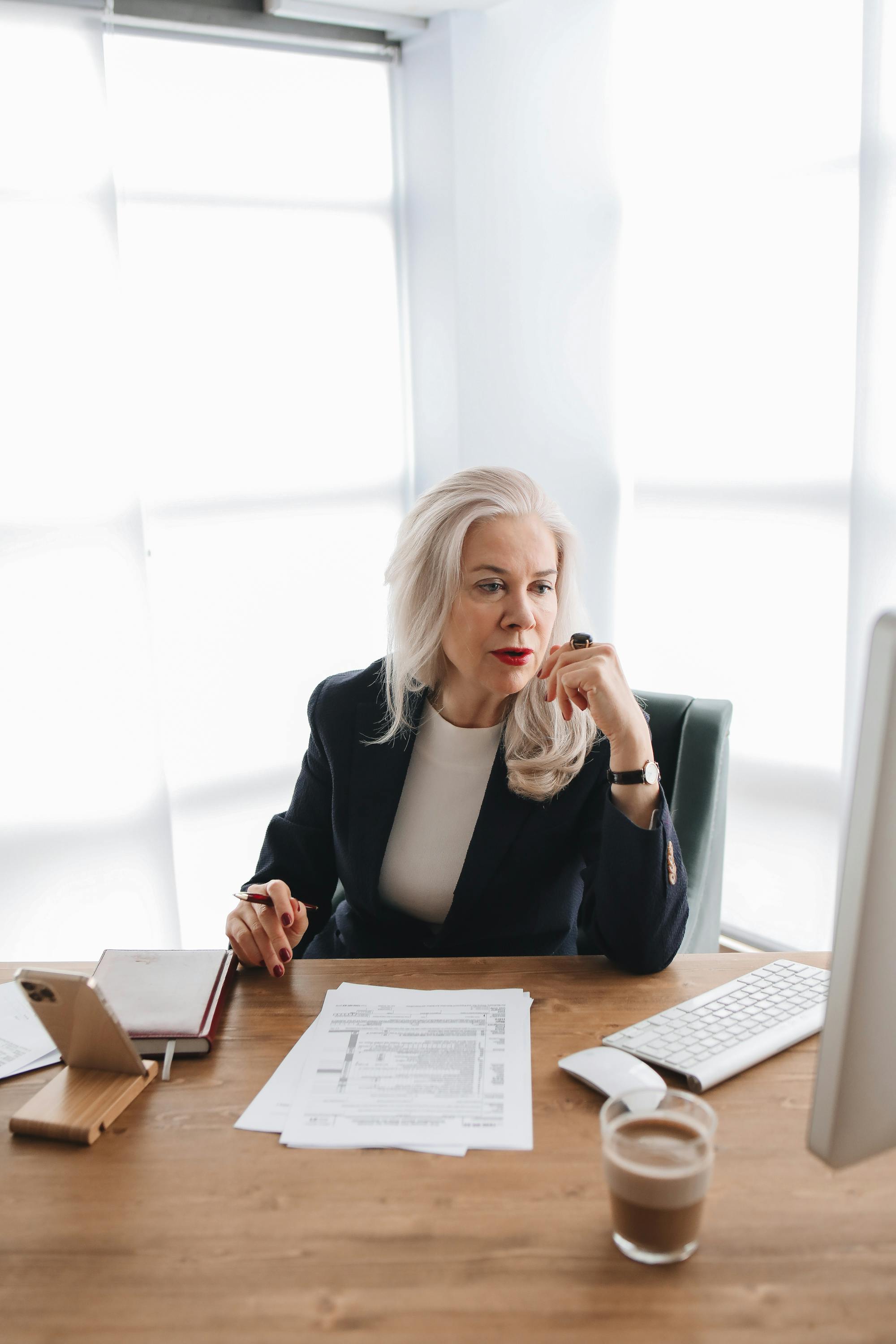 A Woman Sitting at the Table · Free Stock Photo