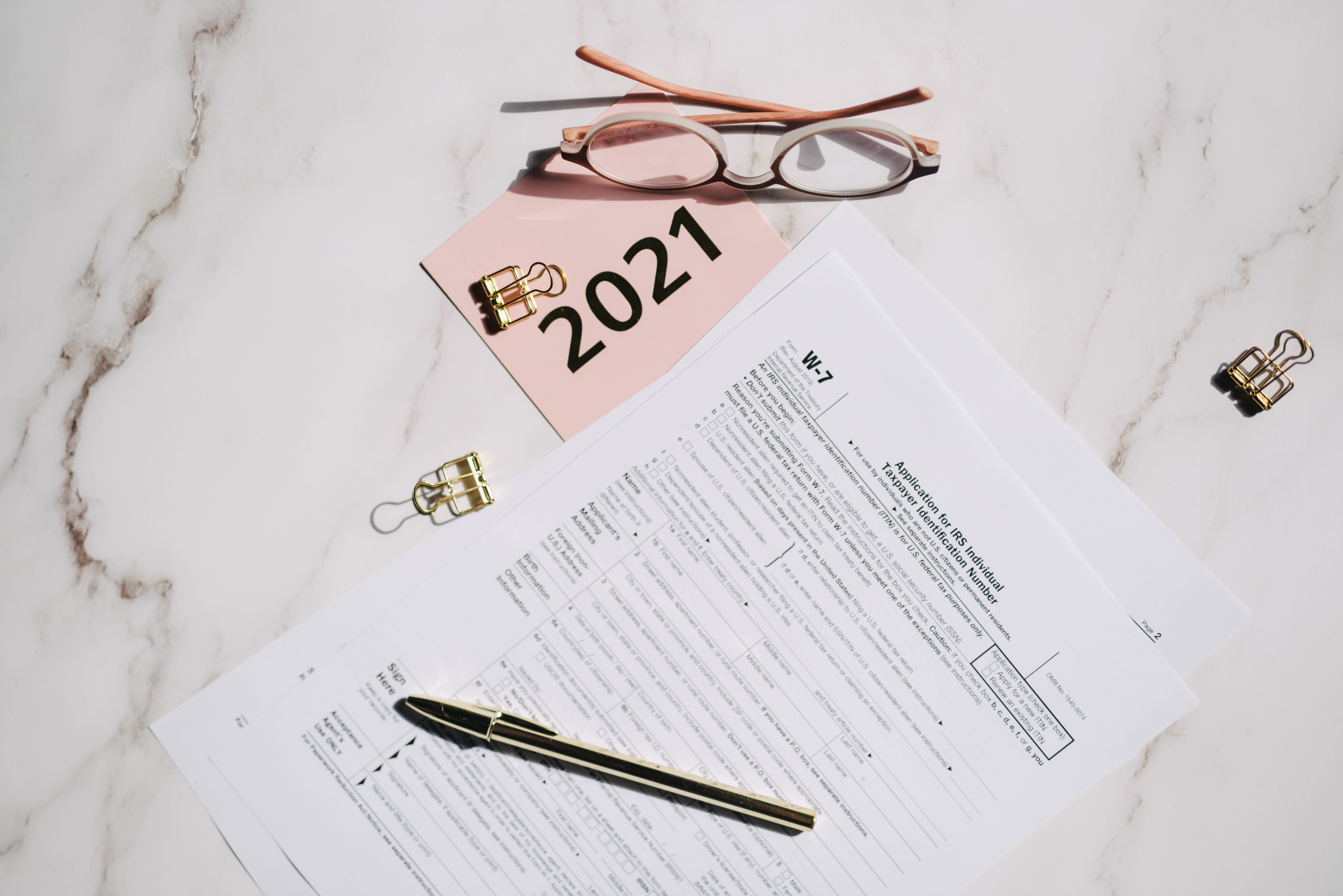 Close-up Photo of Documents on a Clipboard · Free Stock Photo
