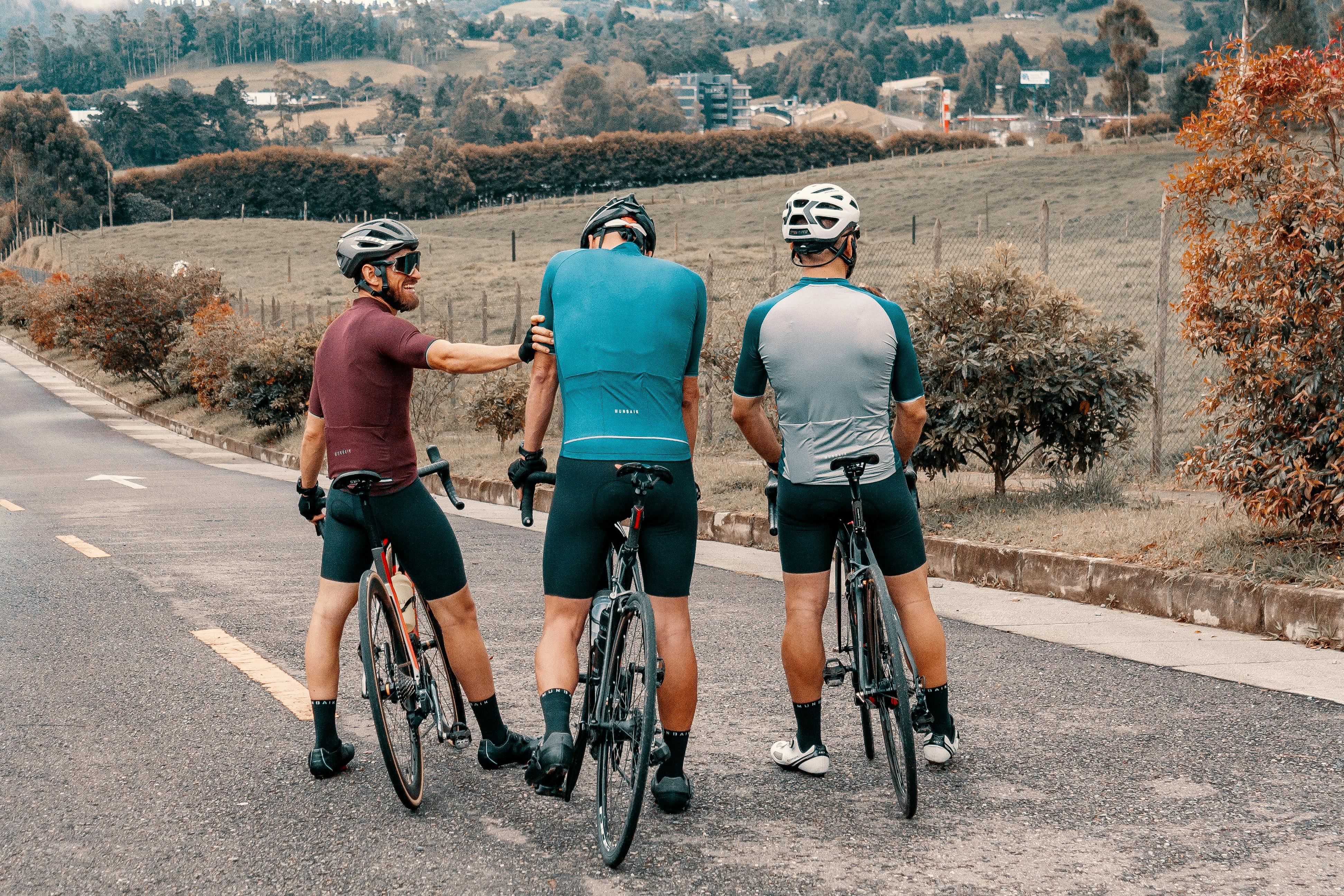 Three Men Riding Bikes · Free Stock Photo