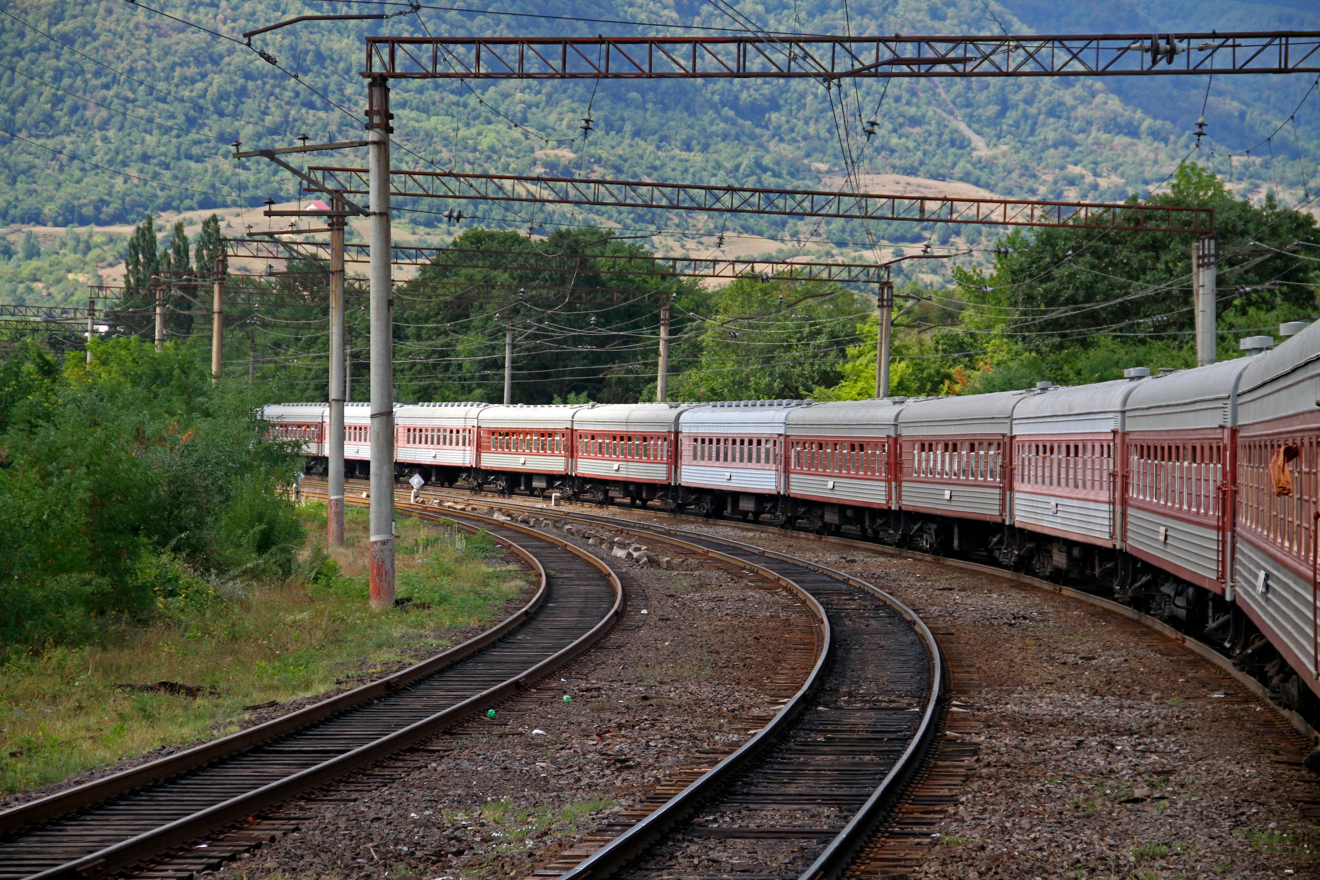 Red and Gray Train on Rail Tracks · Free Stock Photo