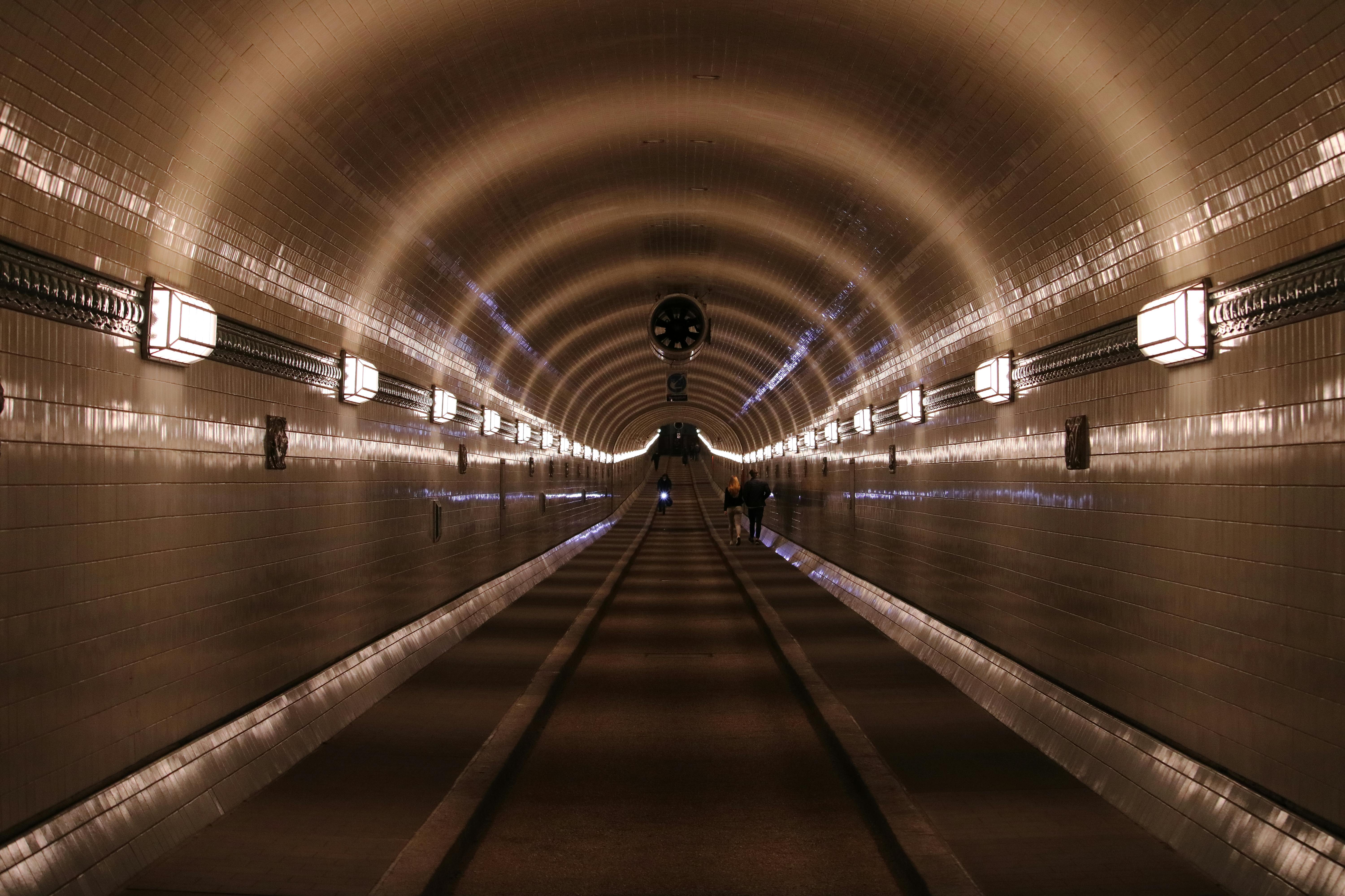 People Walking inside a Tunnel · Free Stock Photo