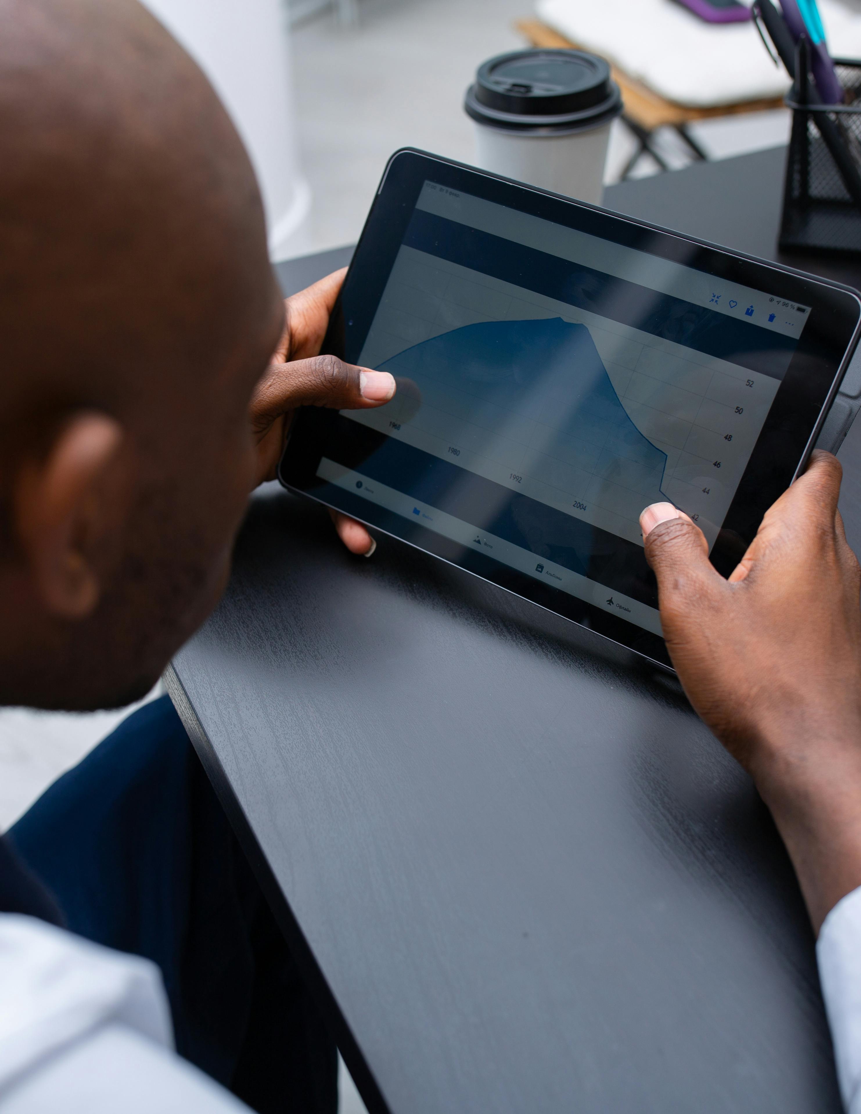 Person Holding Black Digital Tablet · Free Stock Photo