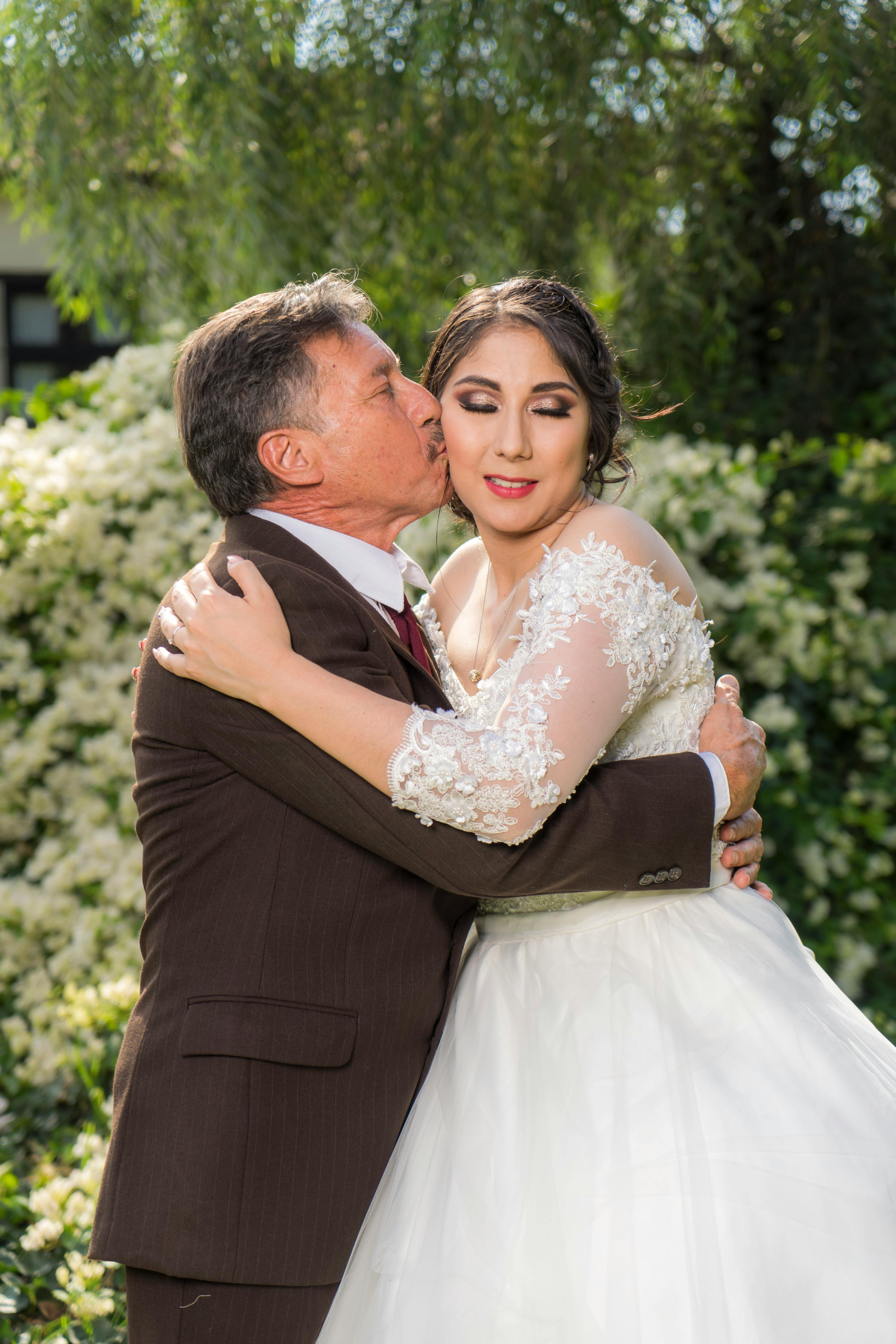 Father Kissing His Daughter on the Cheek on Her Wedding Day · Free ...