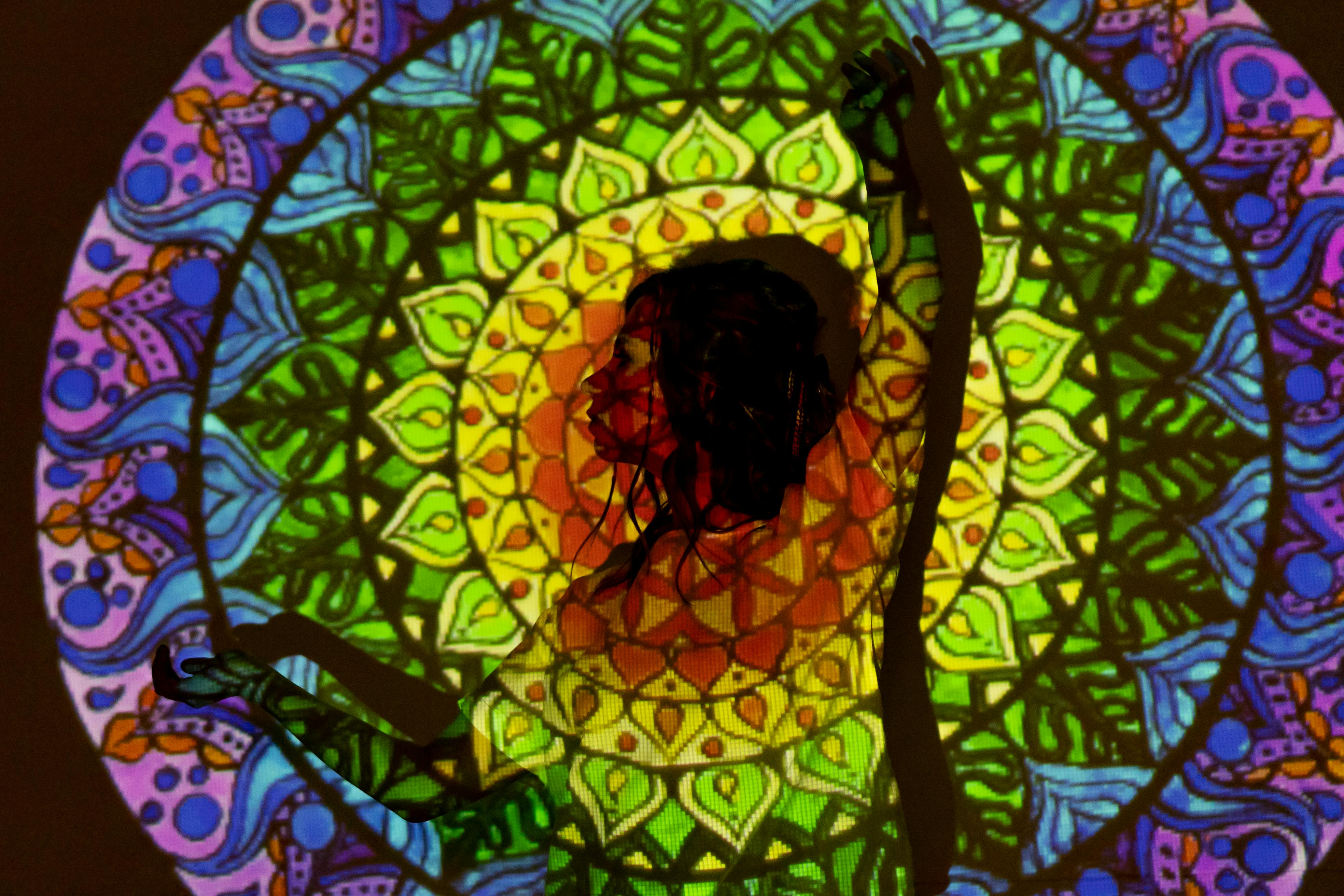 Woman Dancing in front of a Colorful Projection · Free Stock Photo