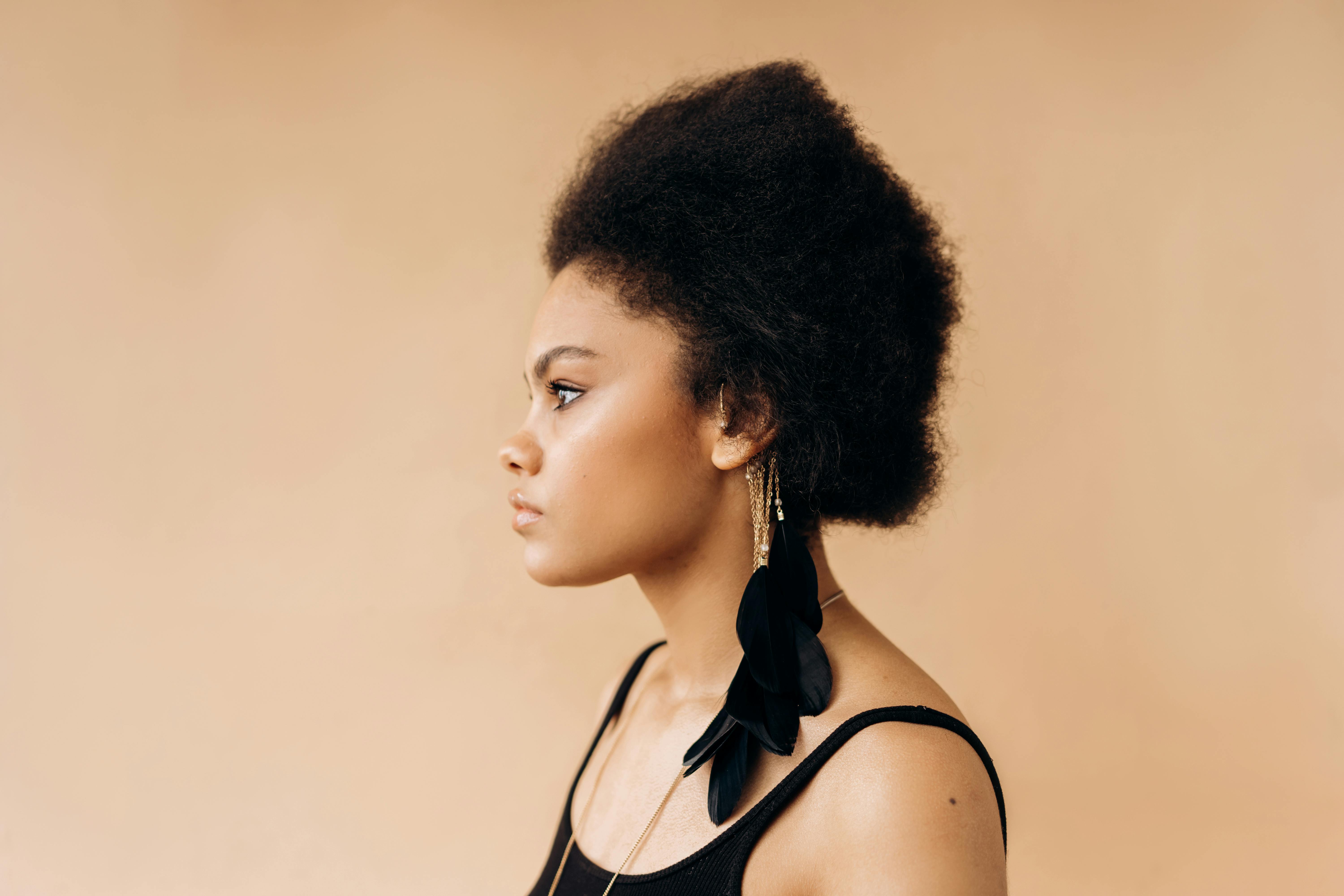 Side View of a Woman with Afro Hair · Free Stock Photo