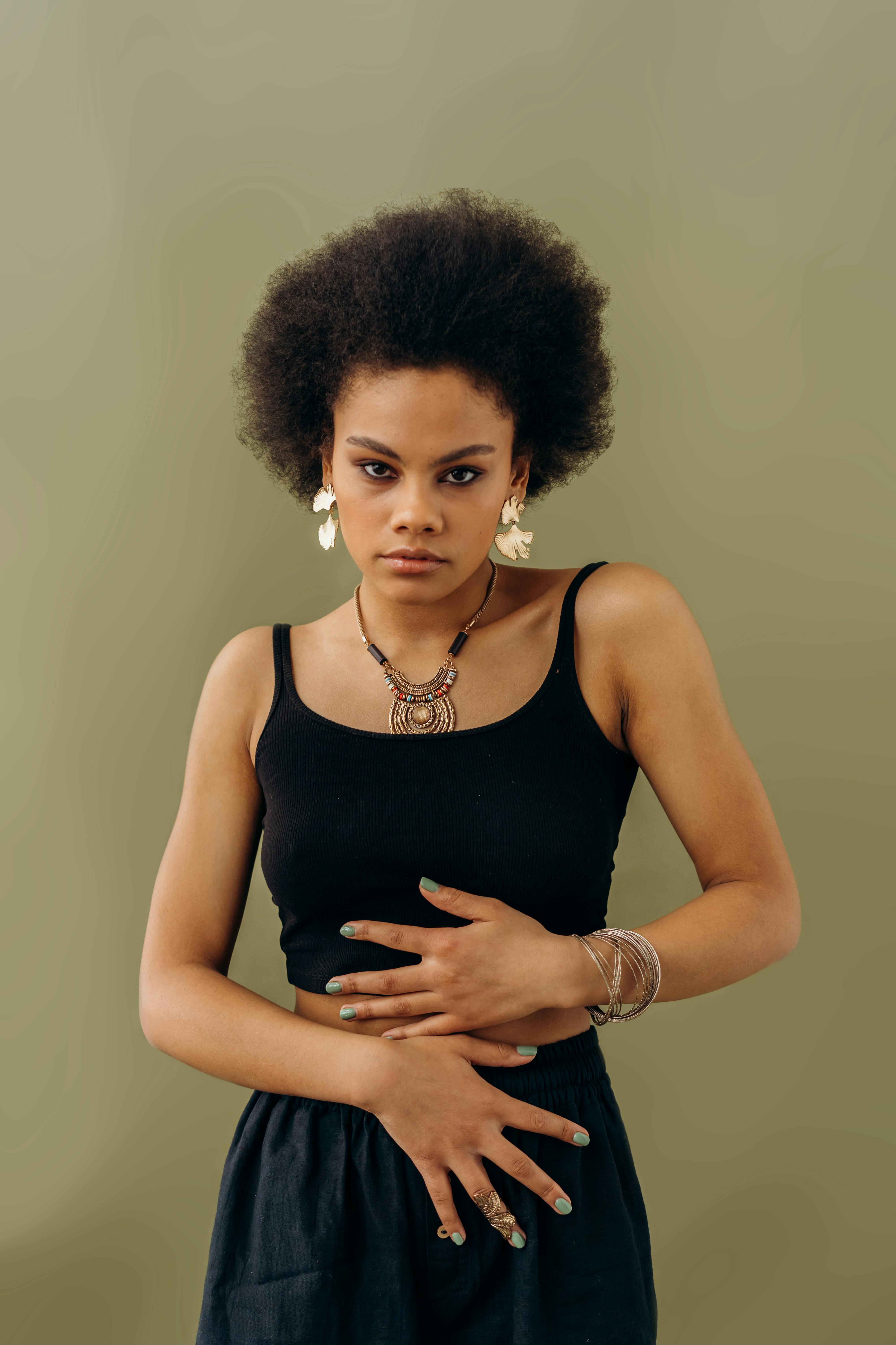 Woman Standing and Touching Wall · Free Stock Photo