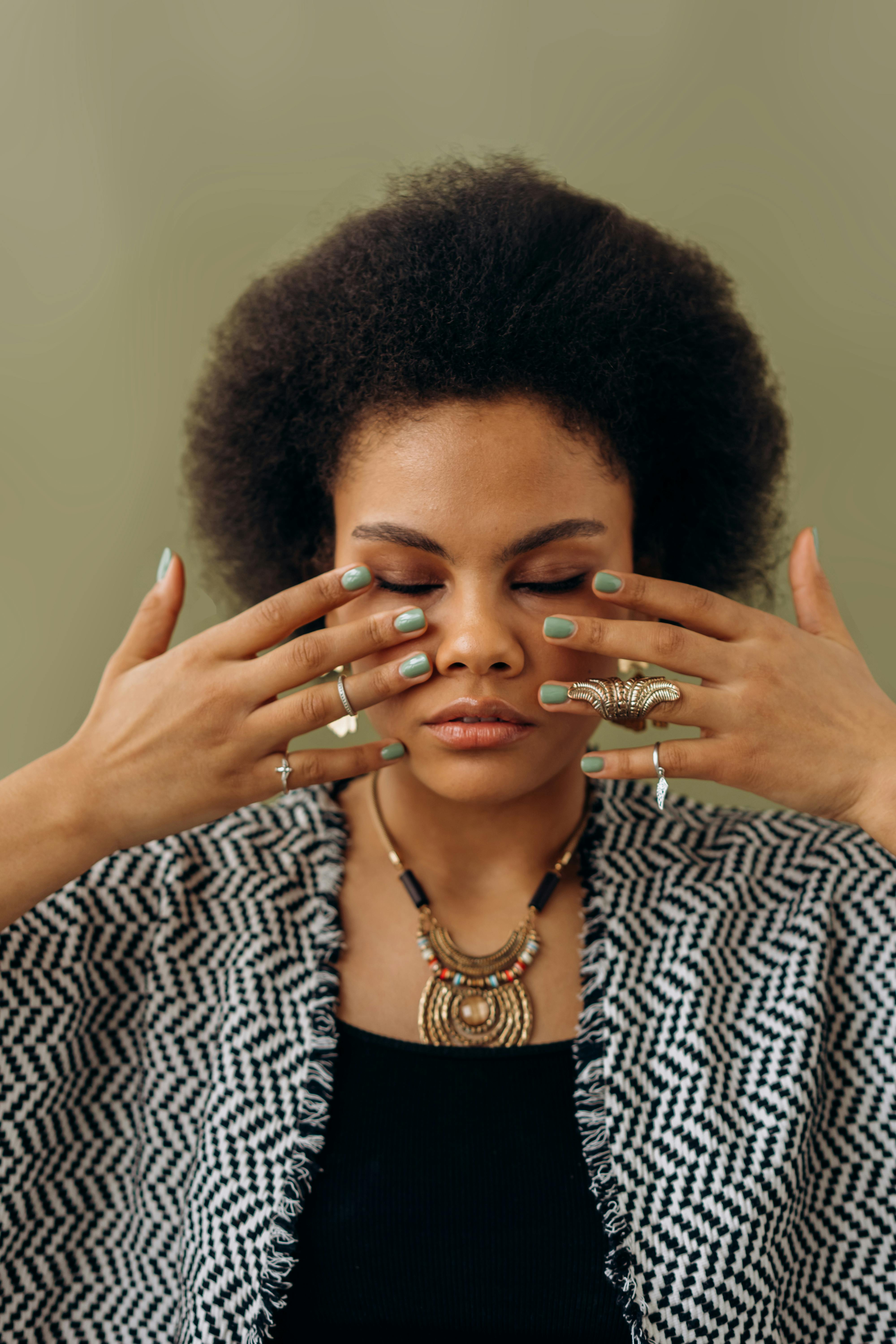 A Woman Wearing Trendy Rings · Free Stock Photo