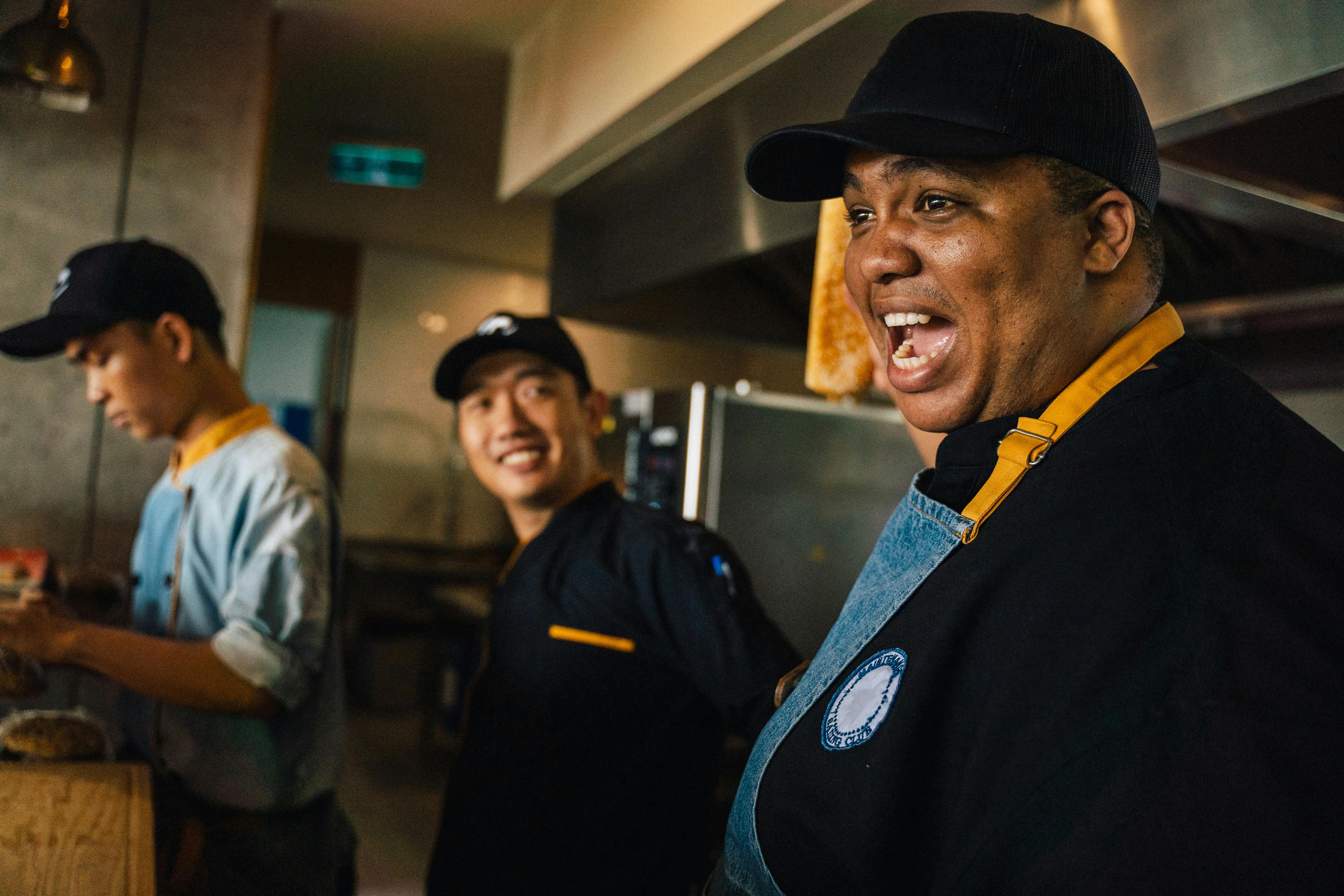 Happy Crews in Black Uniform · Free Stock Photo