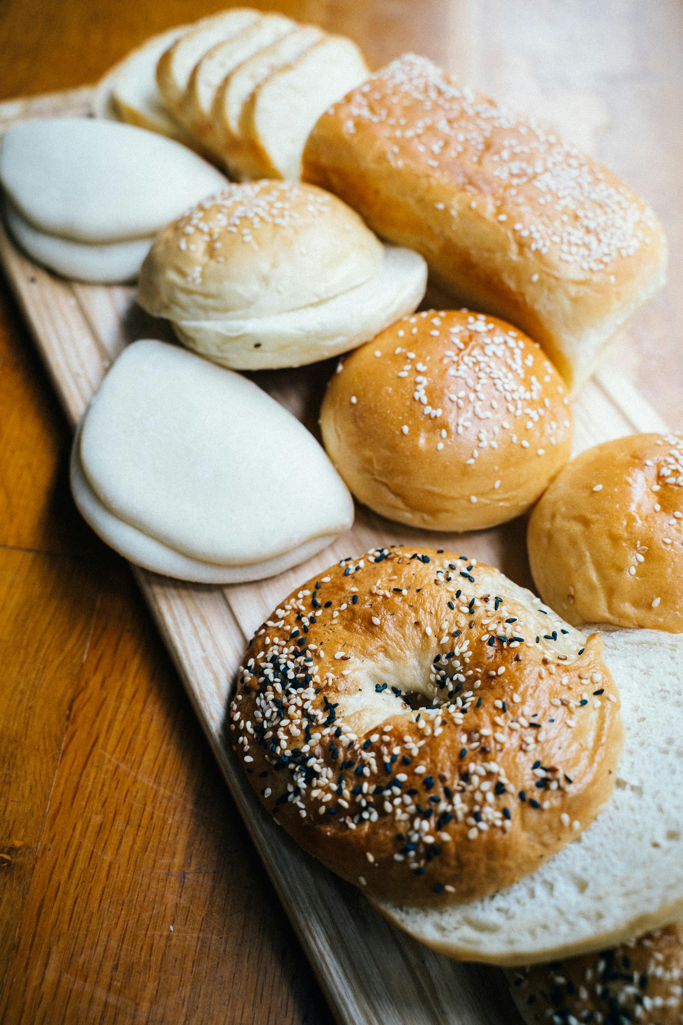 Assorted Bread Served on Wooden Tray · Free Stock Photo