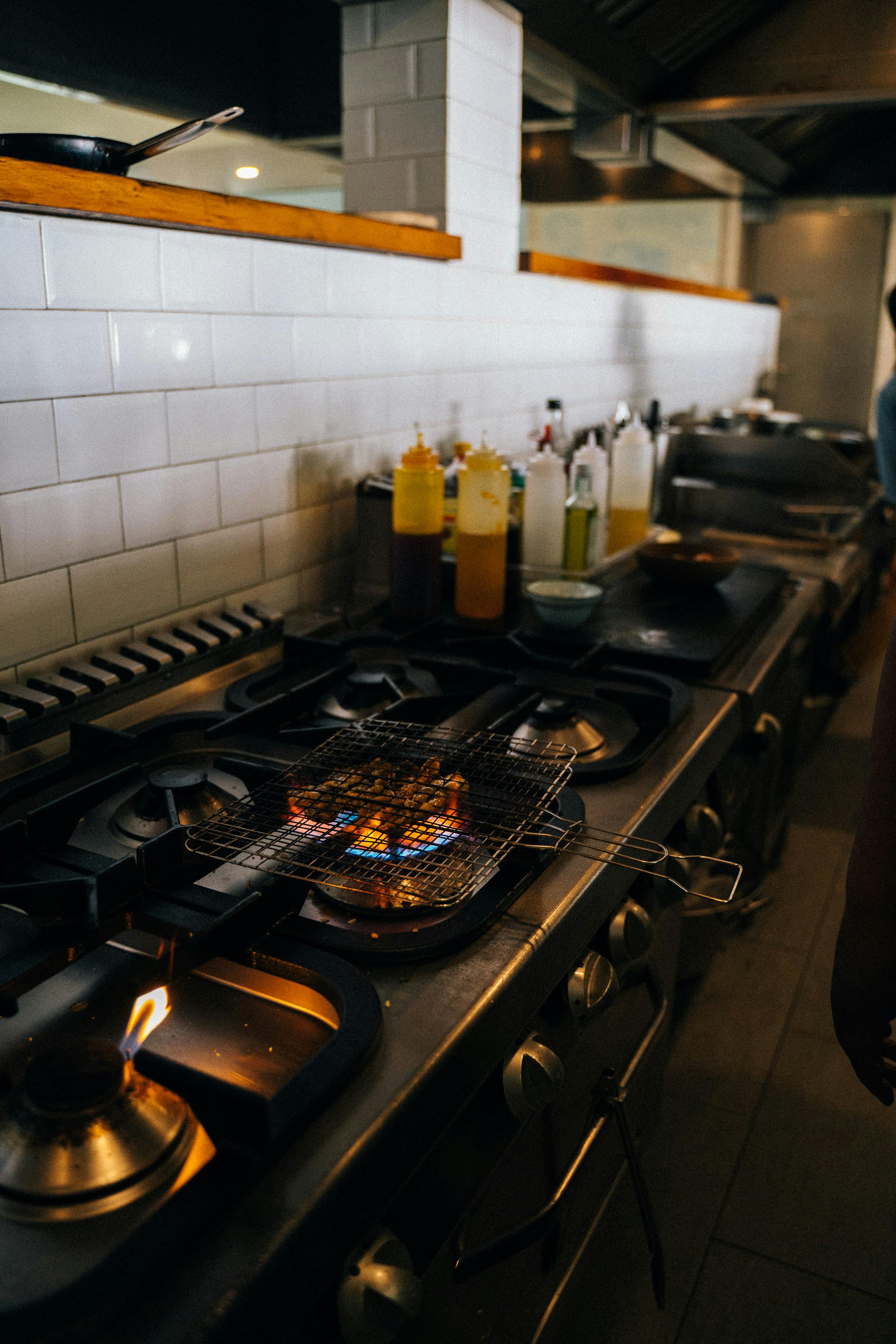 Photo of Men Cooking in a Kitchen · Free Stock Photo