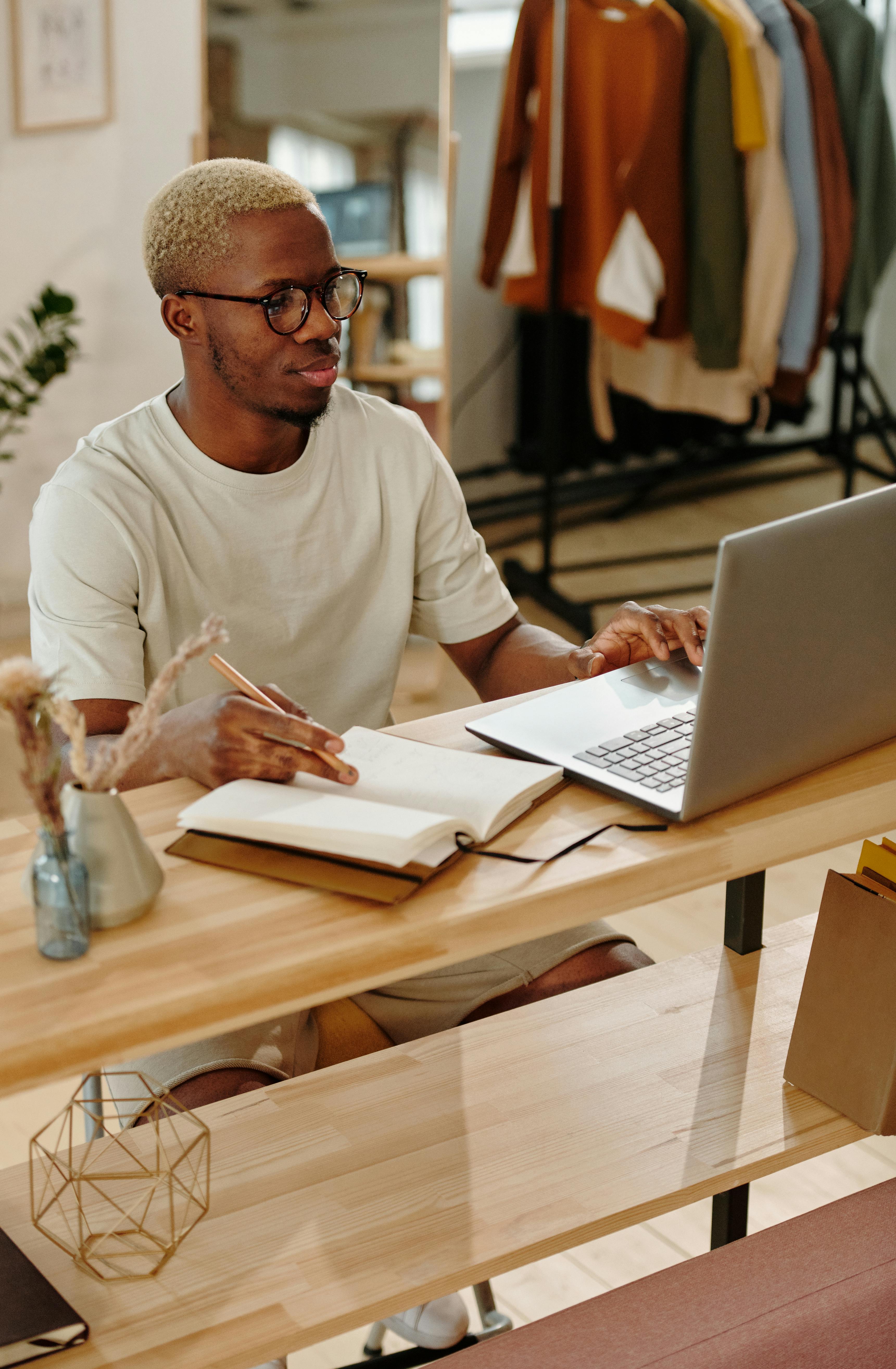 Man in White Shirt using Silver Laptop · Free Stock Photo