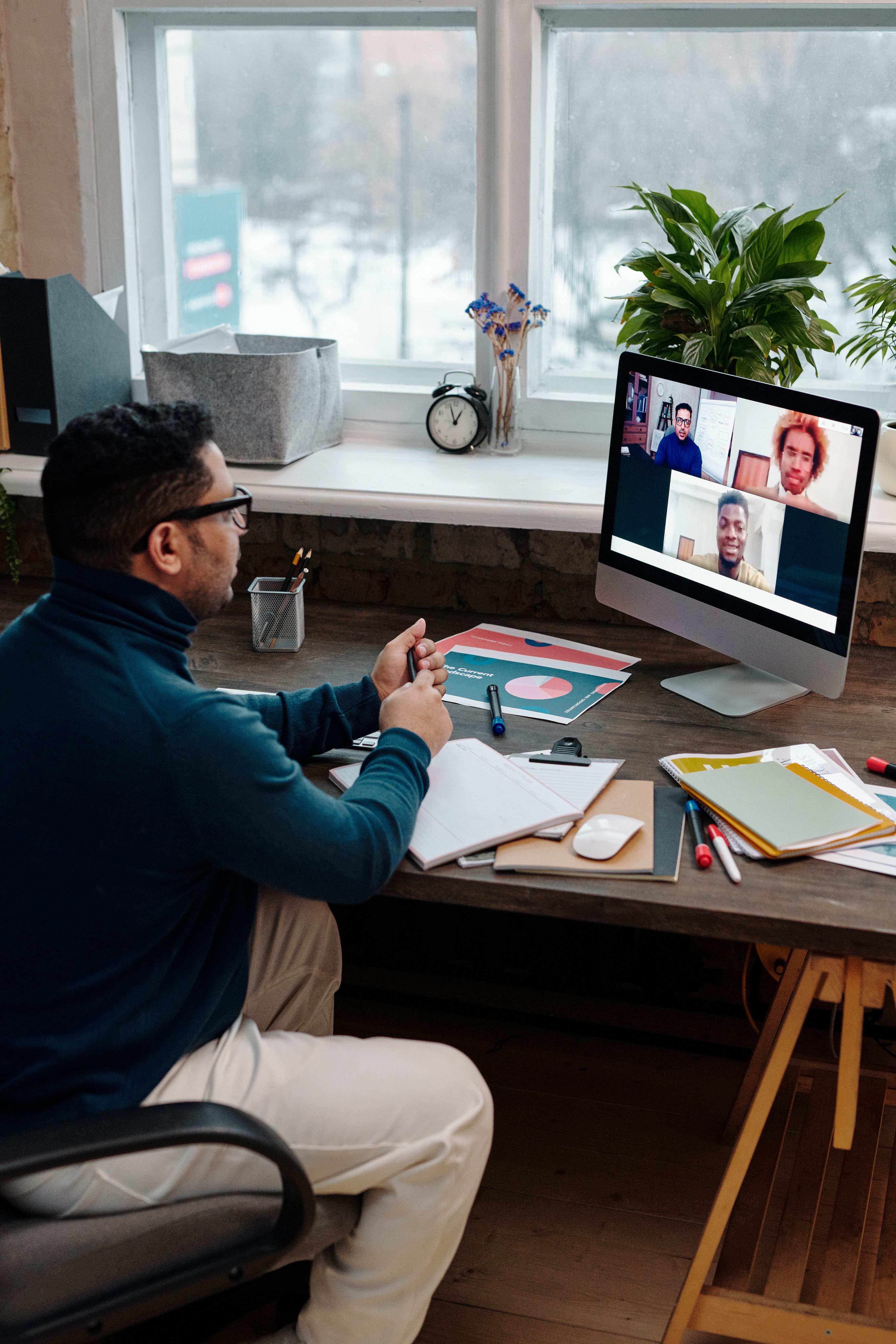 Man in Blue Long Sleeve and White Pants doing a Video Call · Free Stock ...