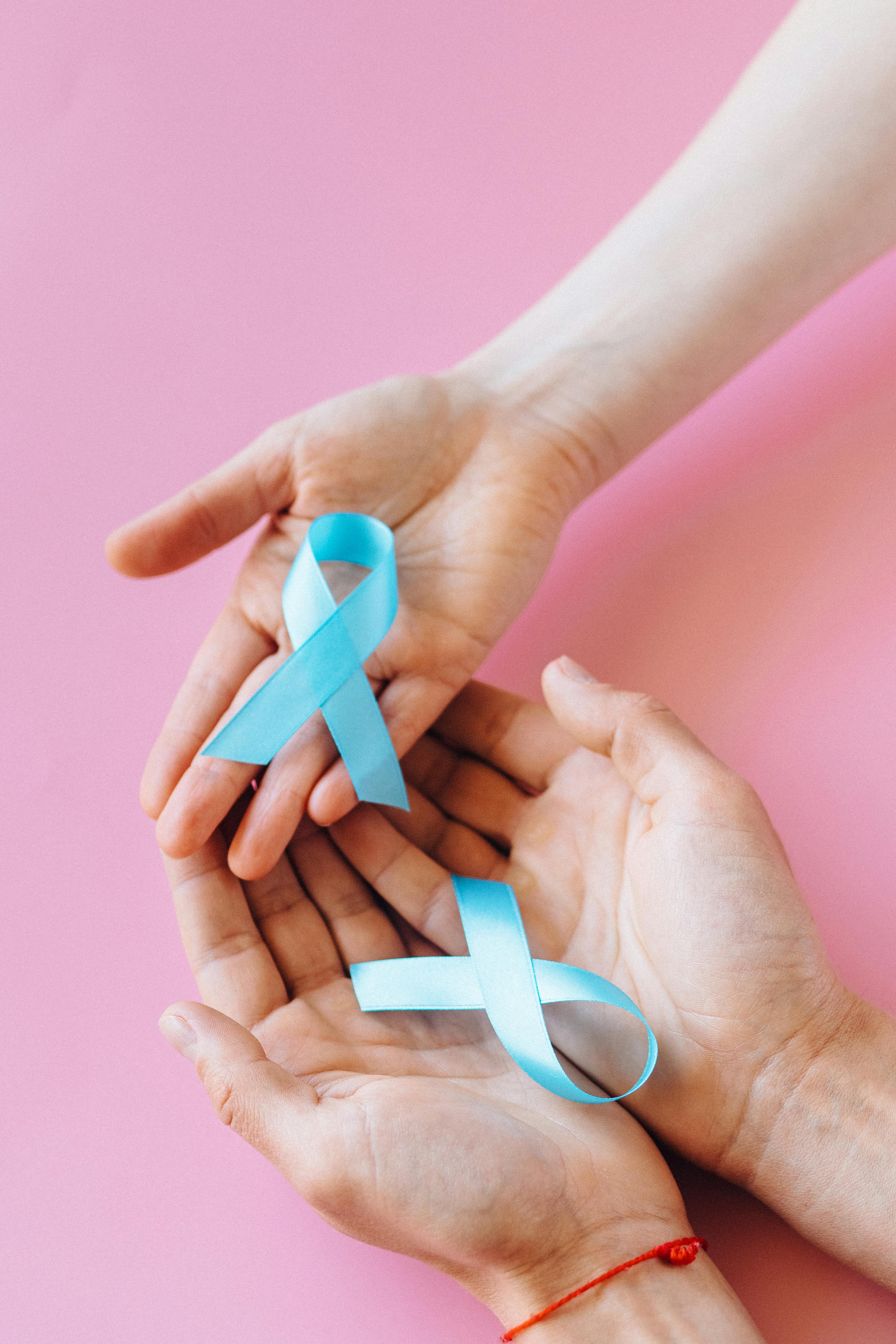 Person Holding Blue Ribbons · Free Stock Photo