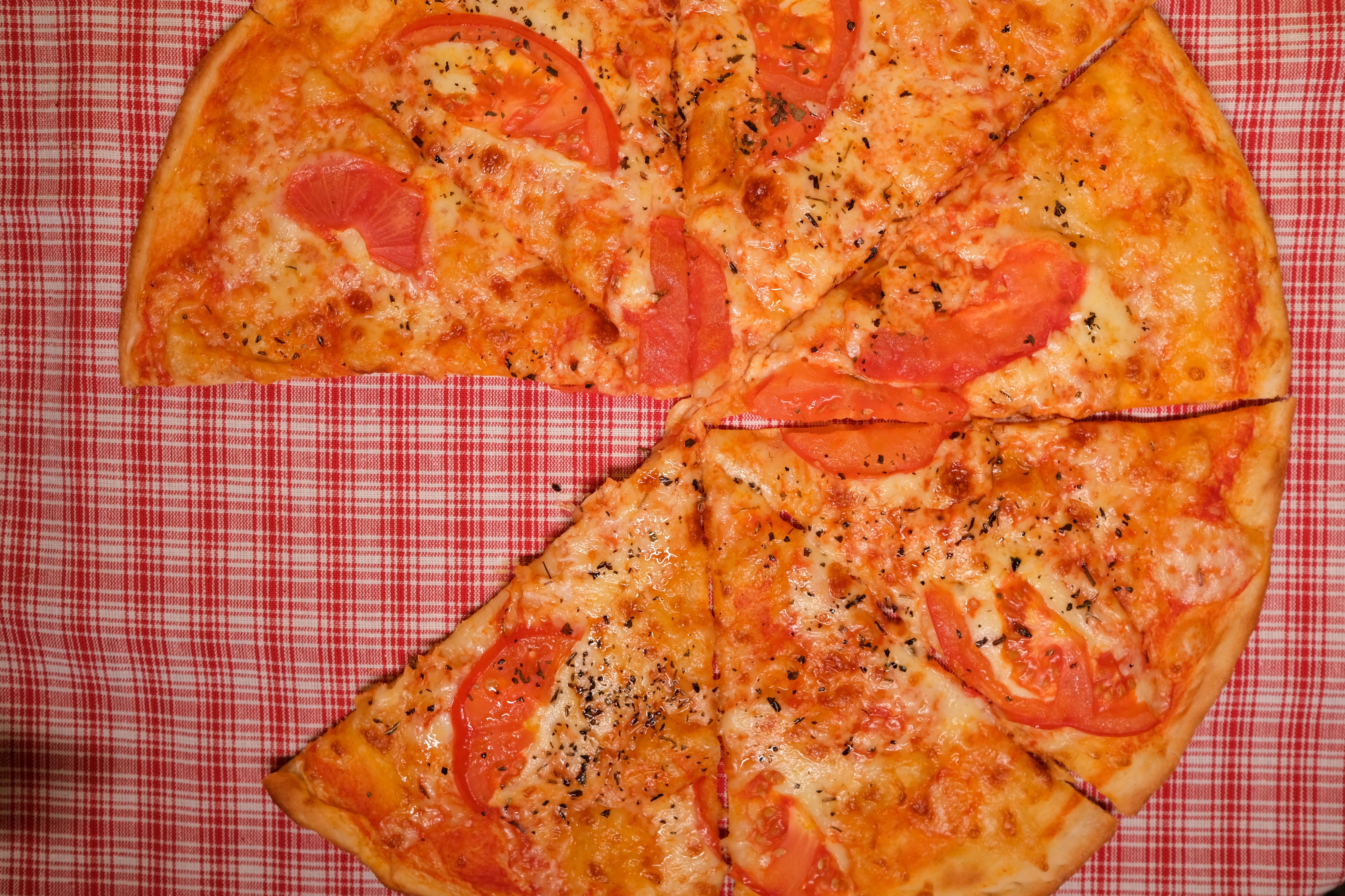 Appetizing pizza placed on table in kitchen · Free Stock Photo