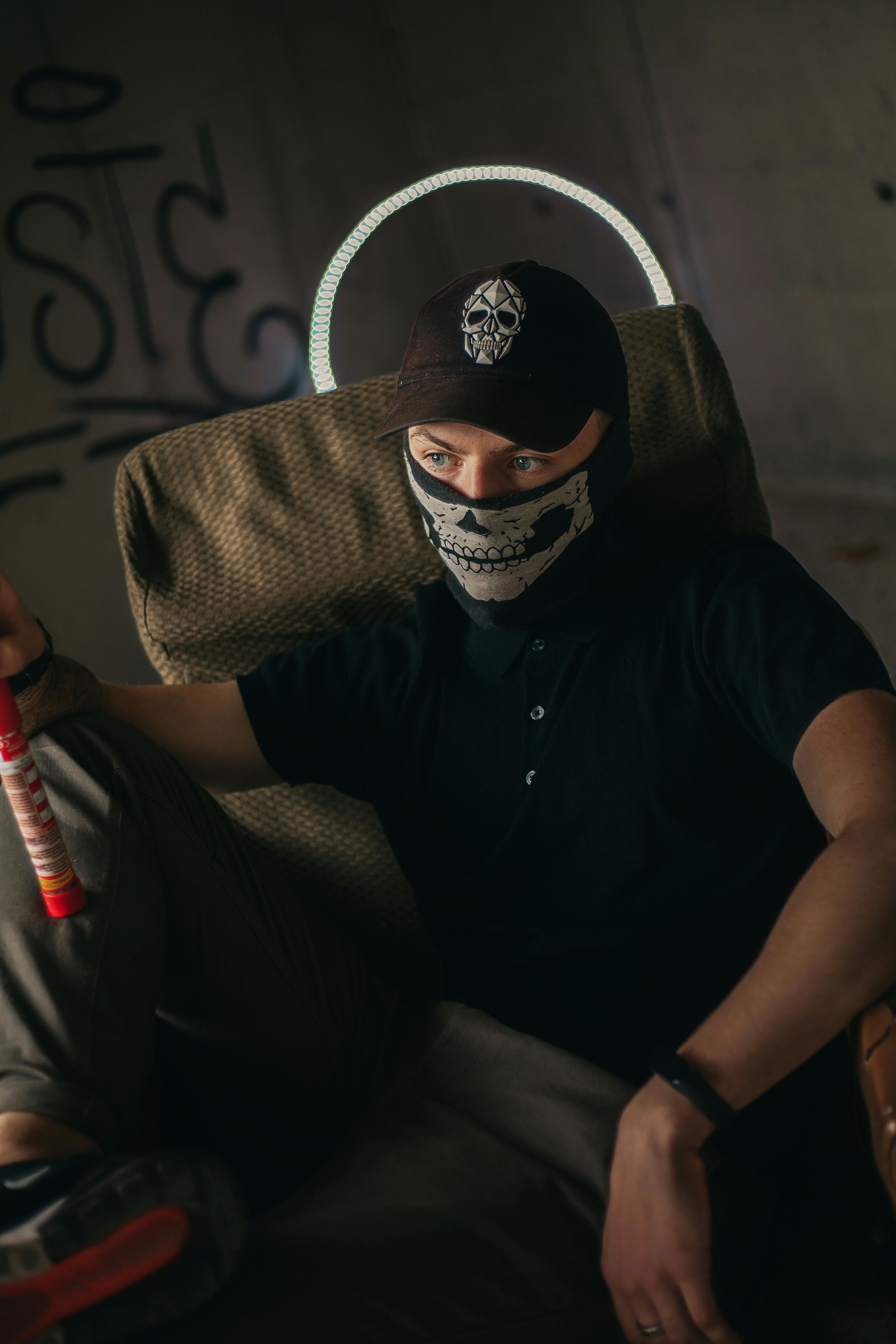 Serious man wearing skull mask · Free Stock Photo