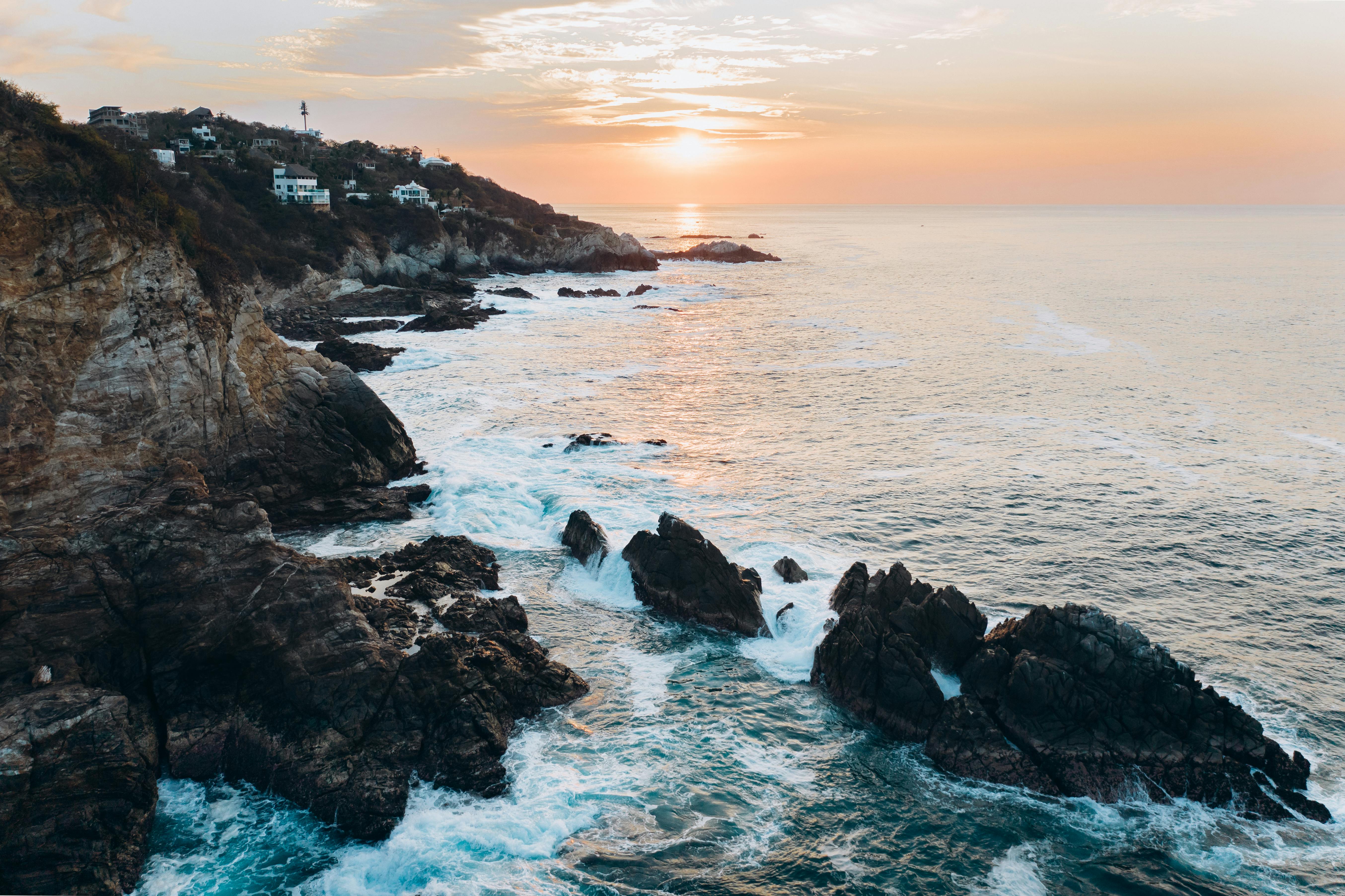Scenic View of Coastal Cliff during Sunset · Free Stock Photo