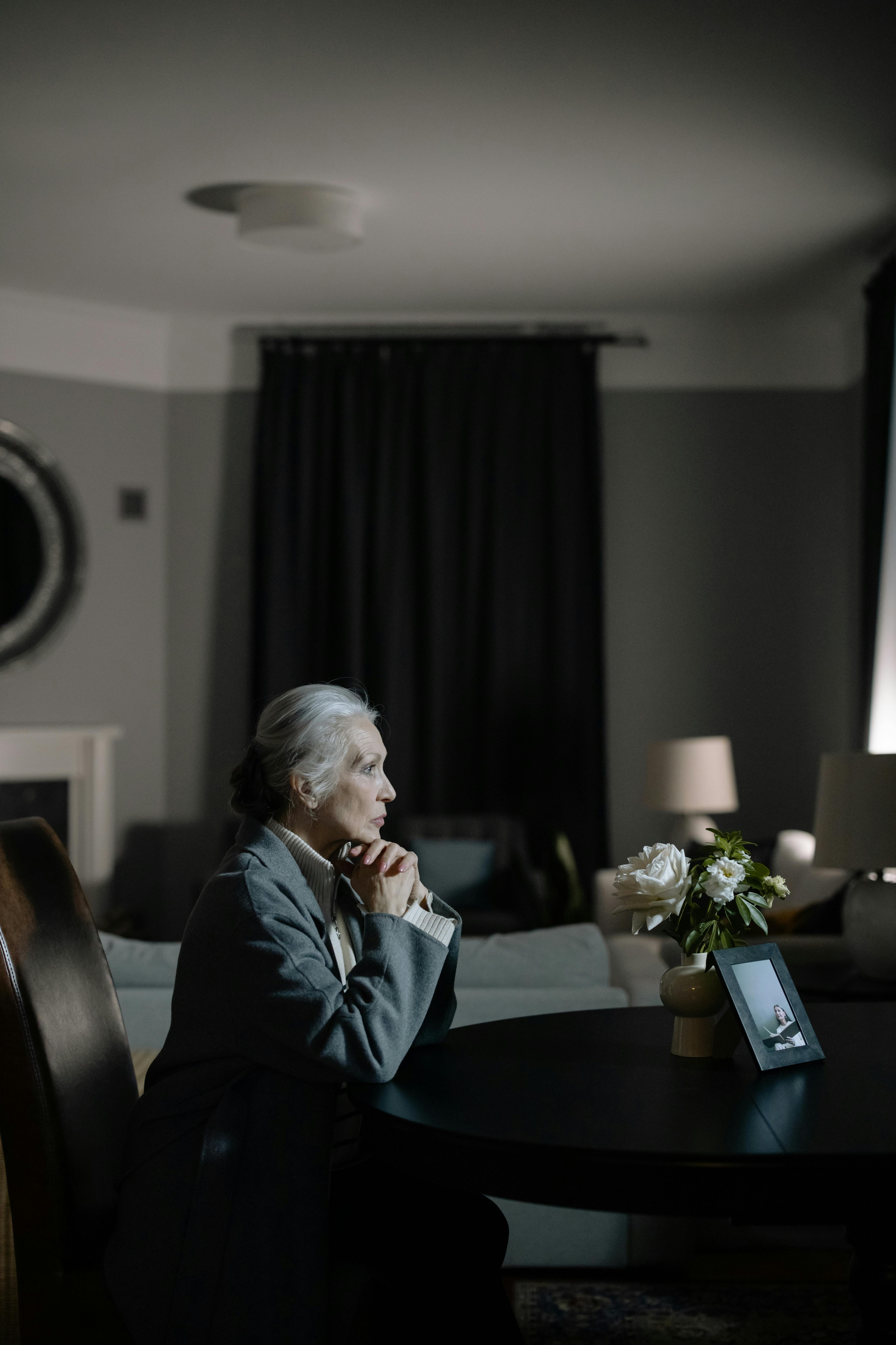 Elderly Woman Sitting at the Table · Free Stock Photo