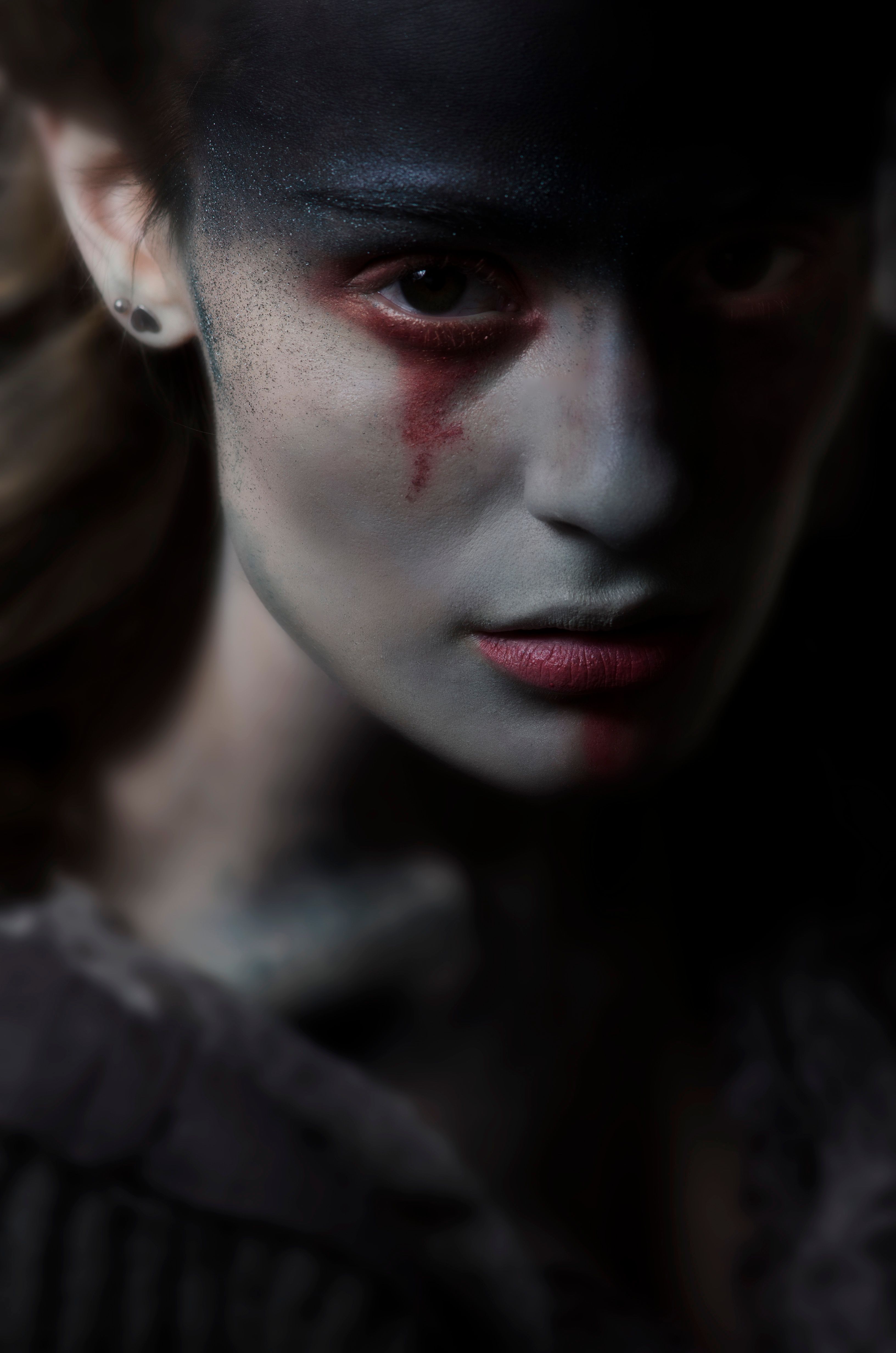 A Woman Looking Fierce Wearing Art Make-up · Free Stock Photo