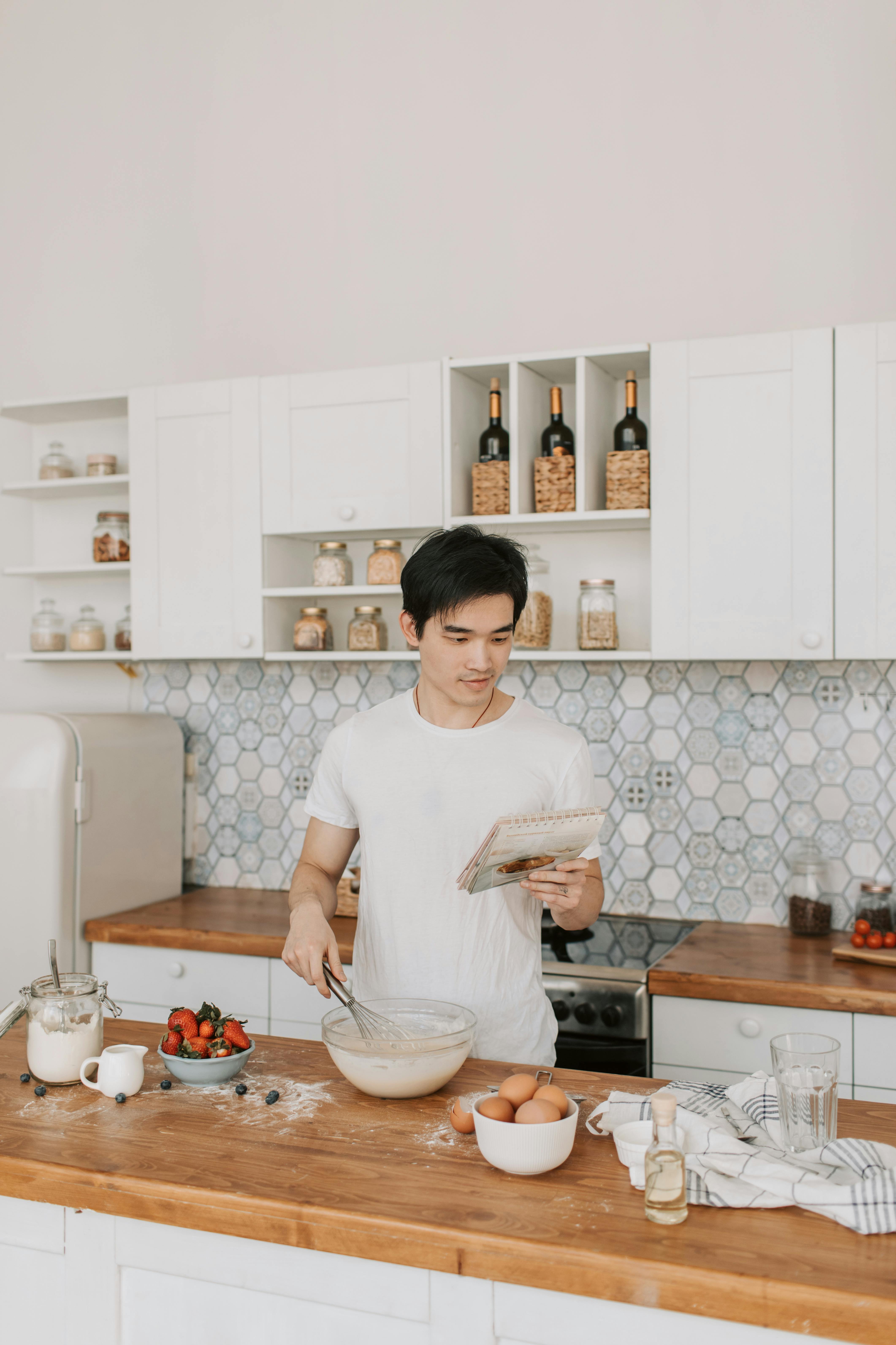 A Man Cooking at the Kitchen · Free Stock Photo