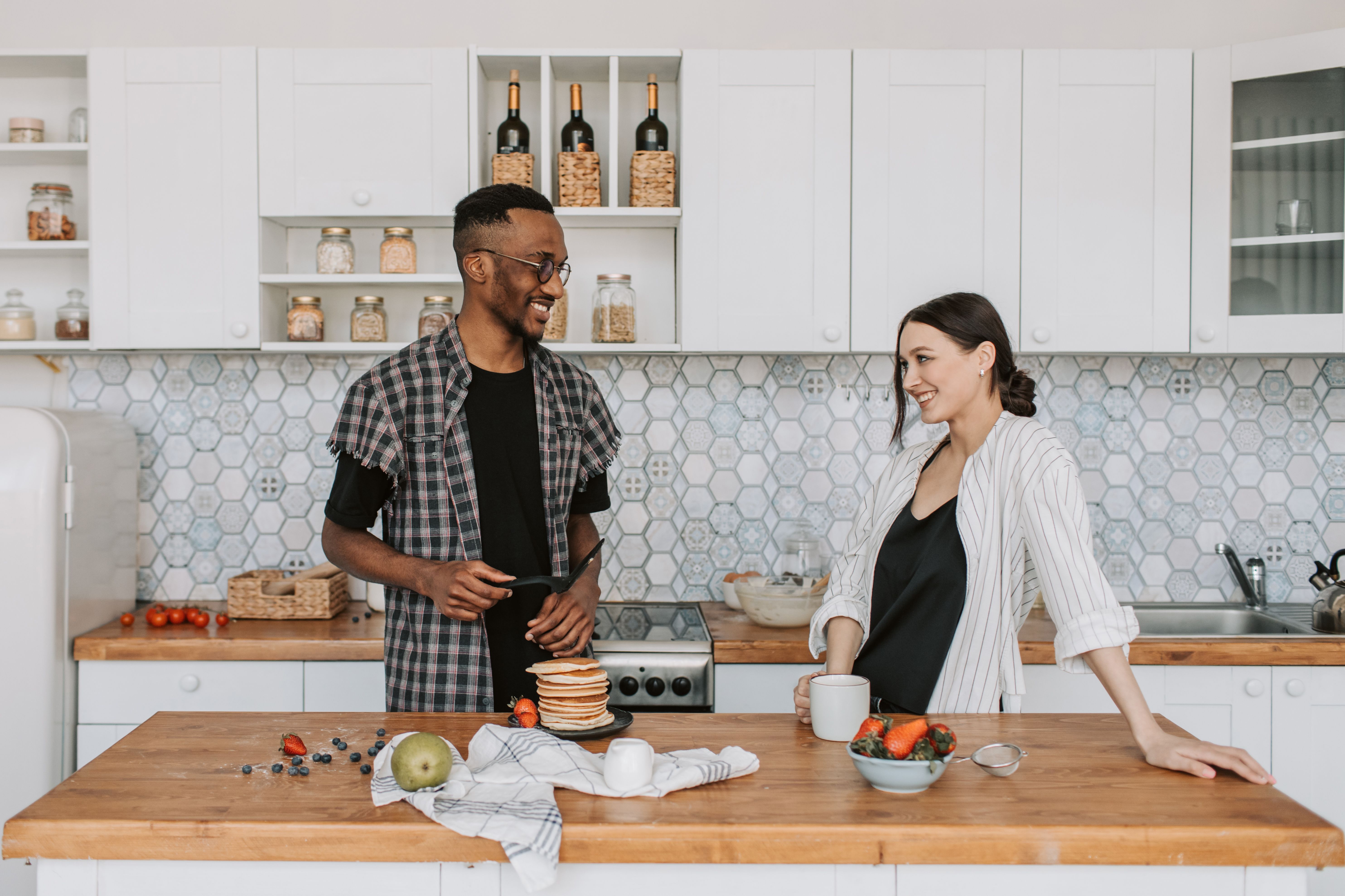 Man and Woman Having Conversation in the Kitchen · Free Stock Photo