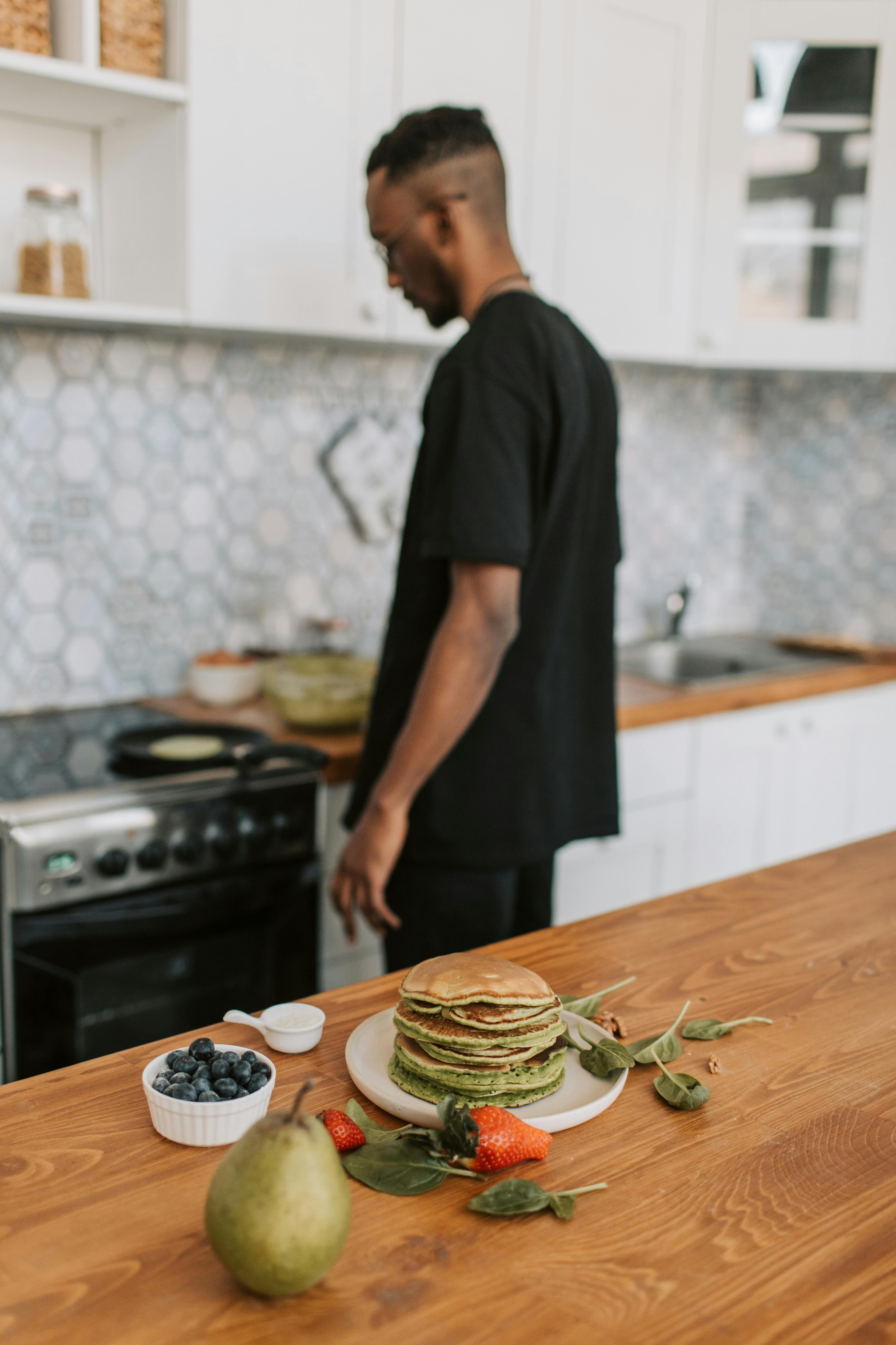 A Man Cooking in the Kitchen · Free Stock Photo