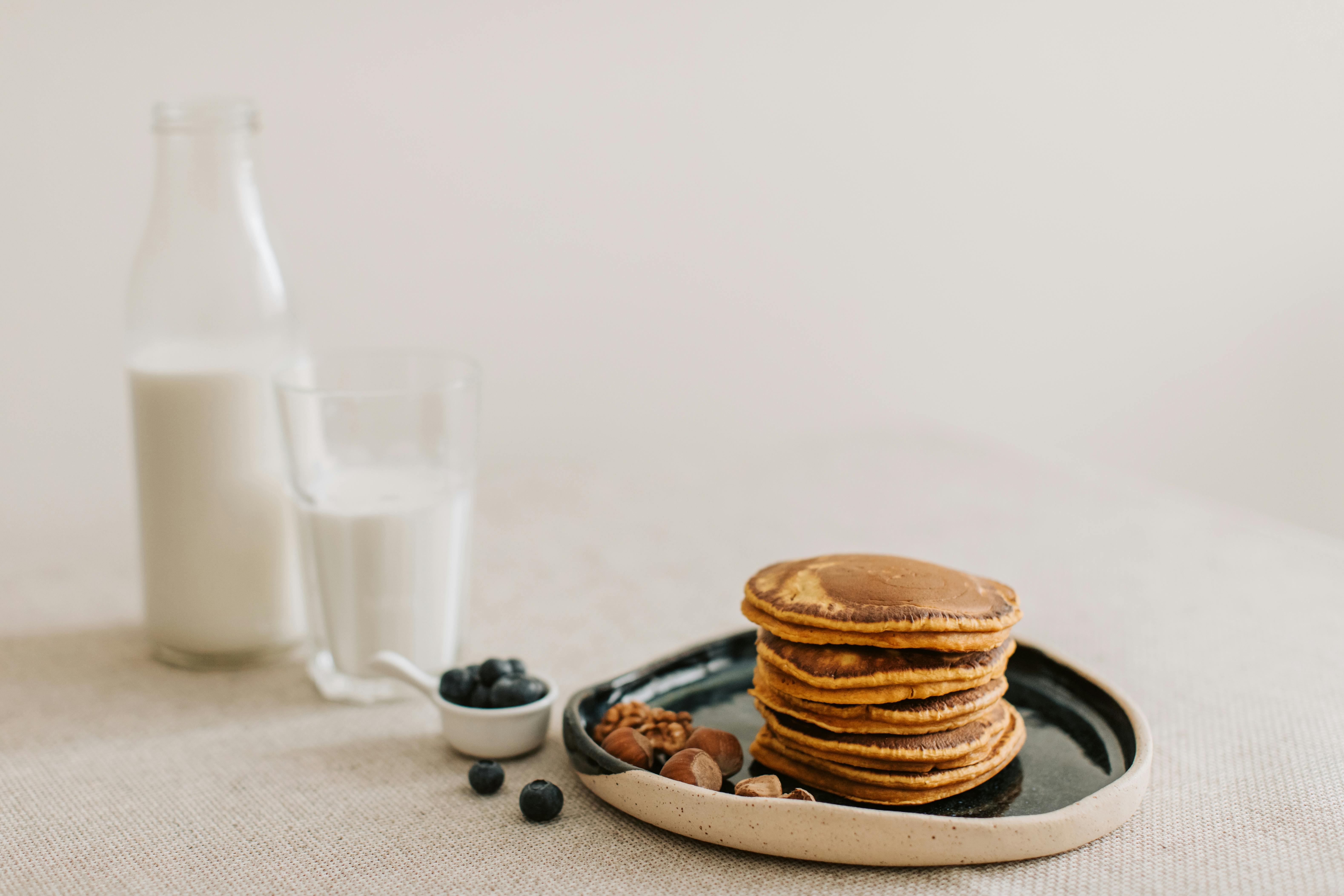 Pancakes on a Plate and a Glass of Milk · Free Stock Photo