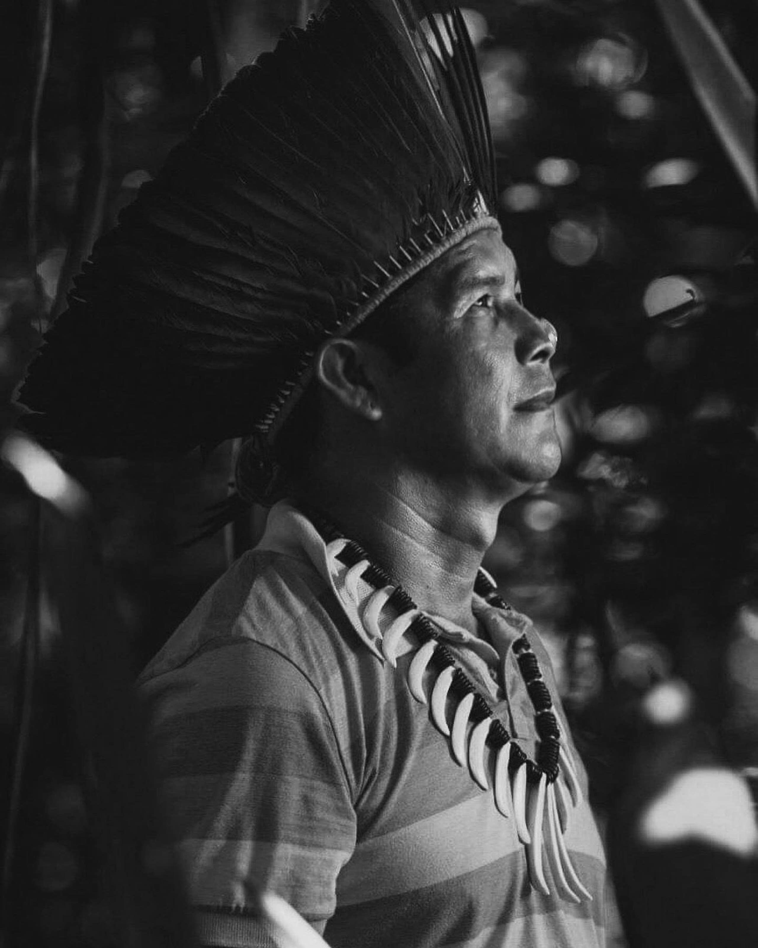 Three Men in Traditional Native American Clothes Playing on Side of ...