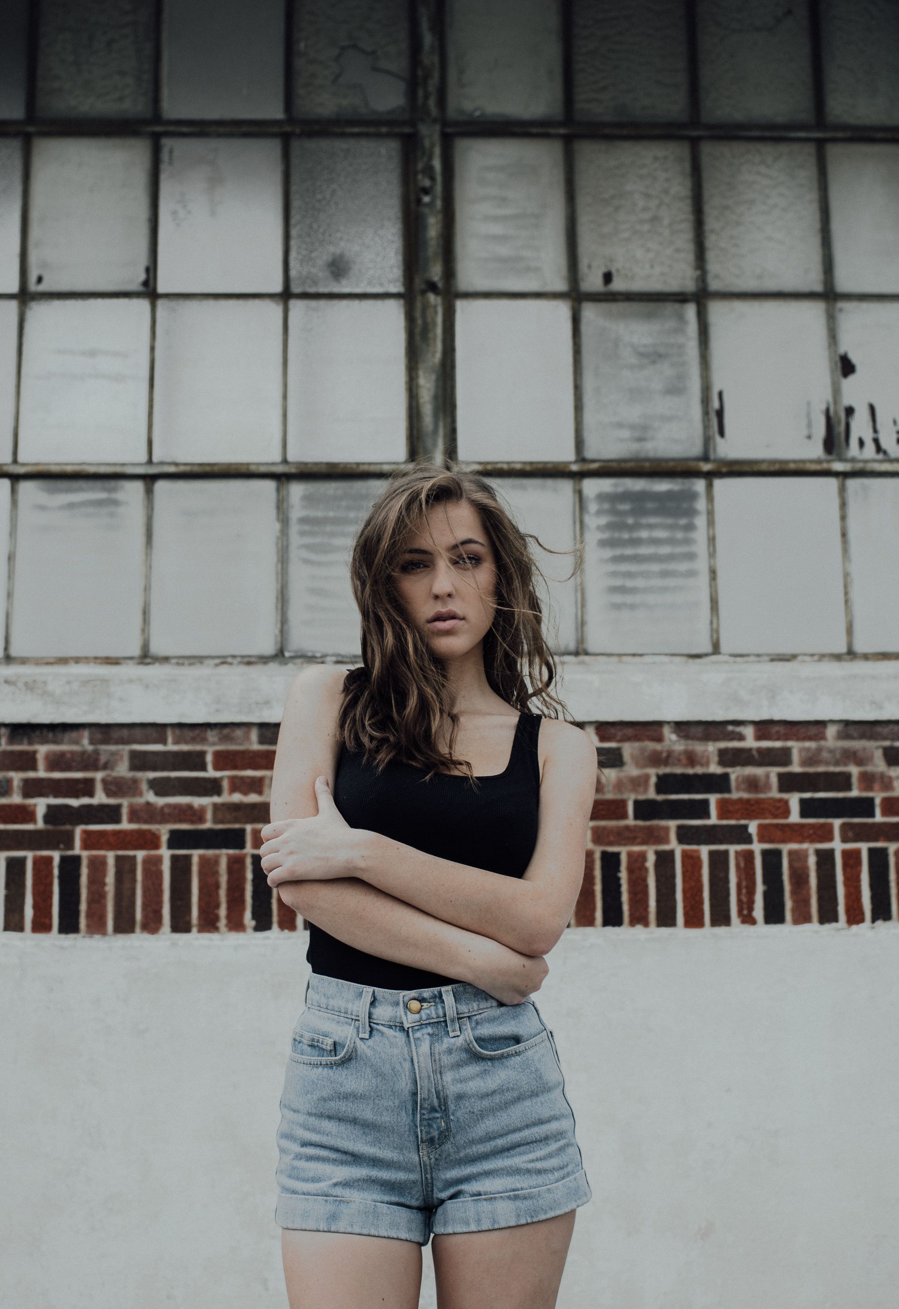 Photo of a Girl with Her Arms Crossed · Free Stock Photo