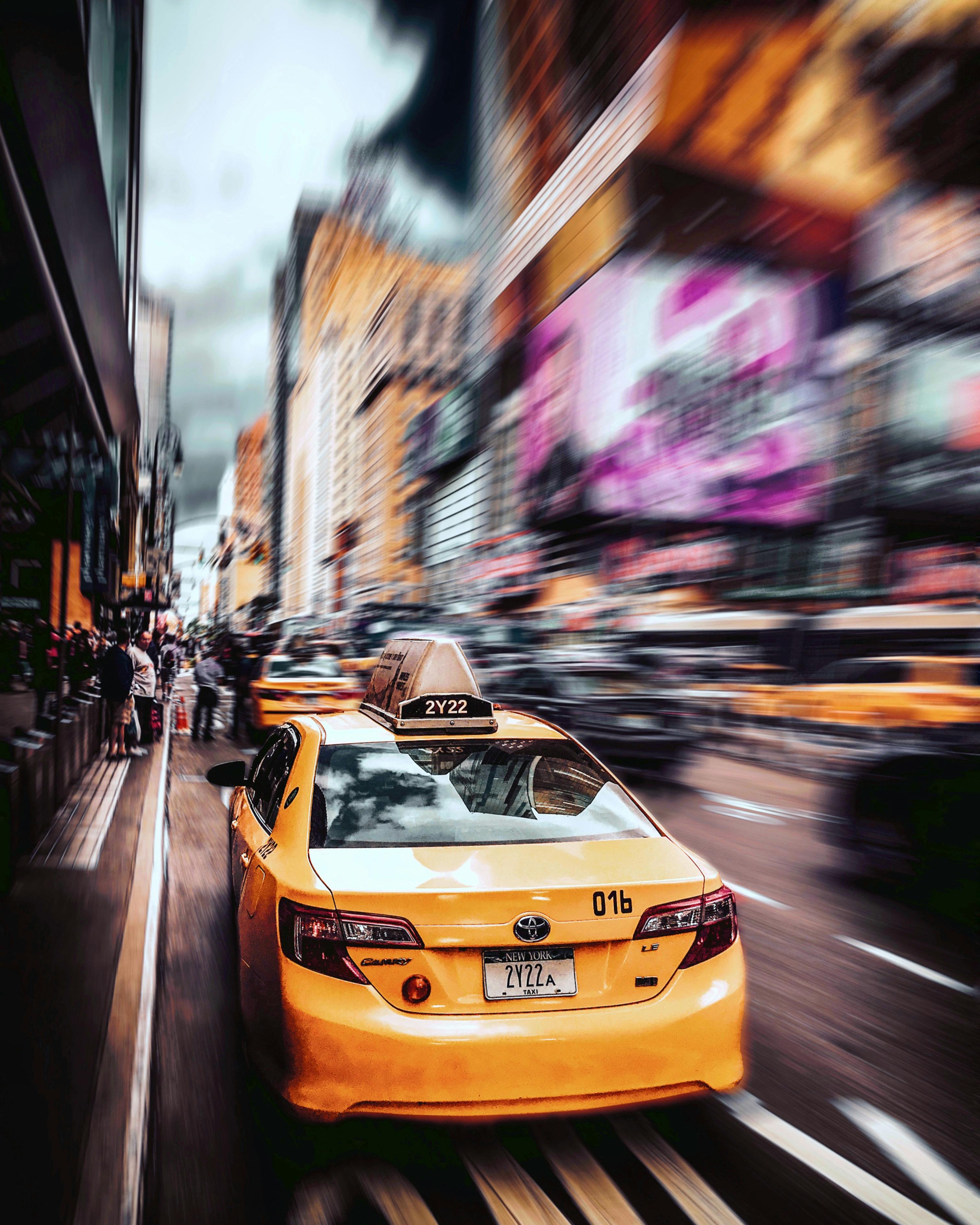 A Yellow Taxi Cab on the Road · Free Stock Photo