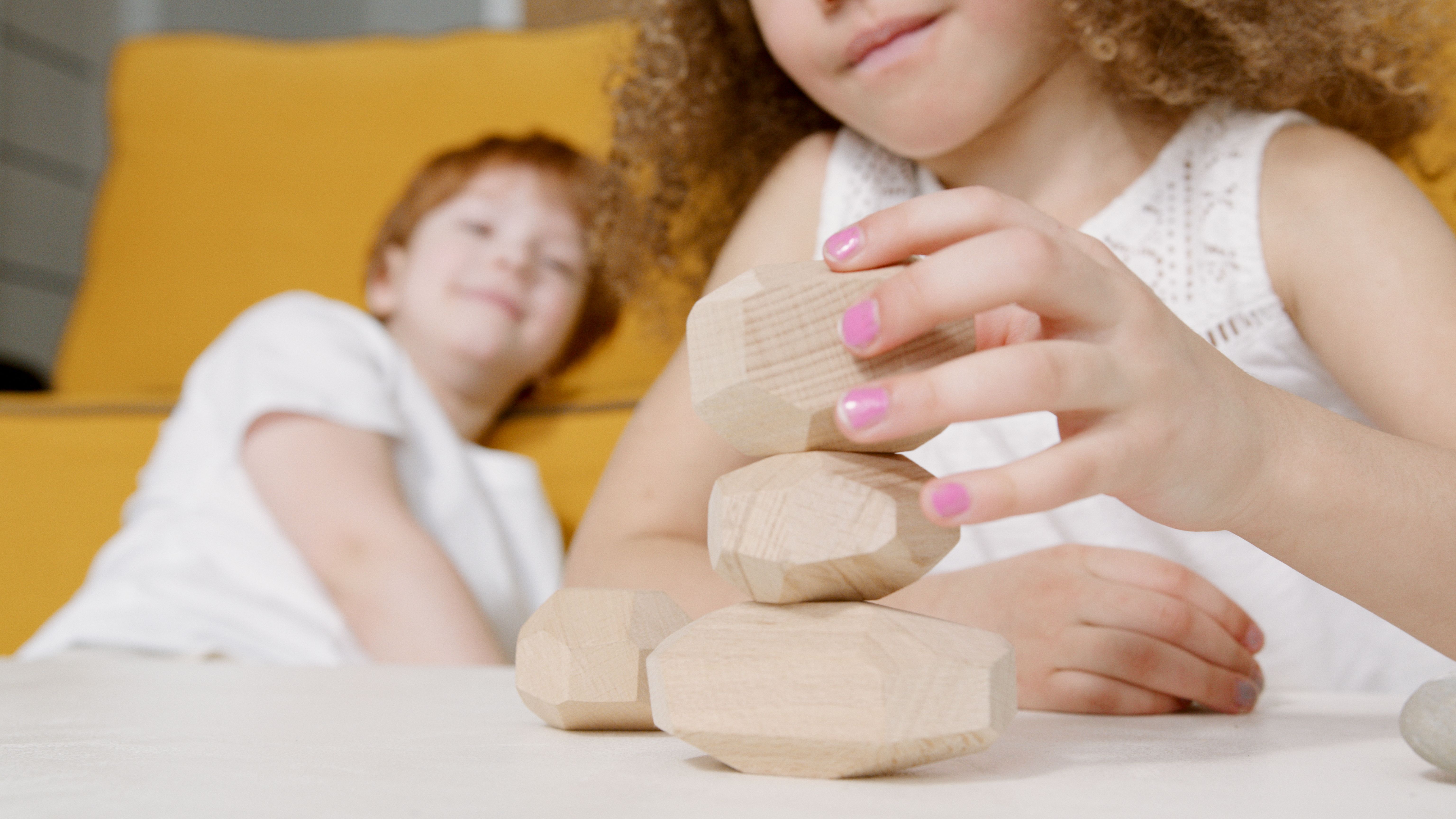 A Hand Holding Wooden Toy Number · Free Stock Photo