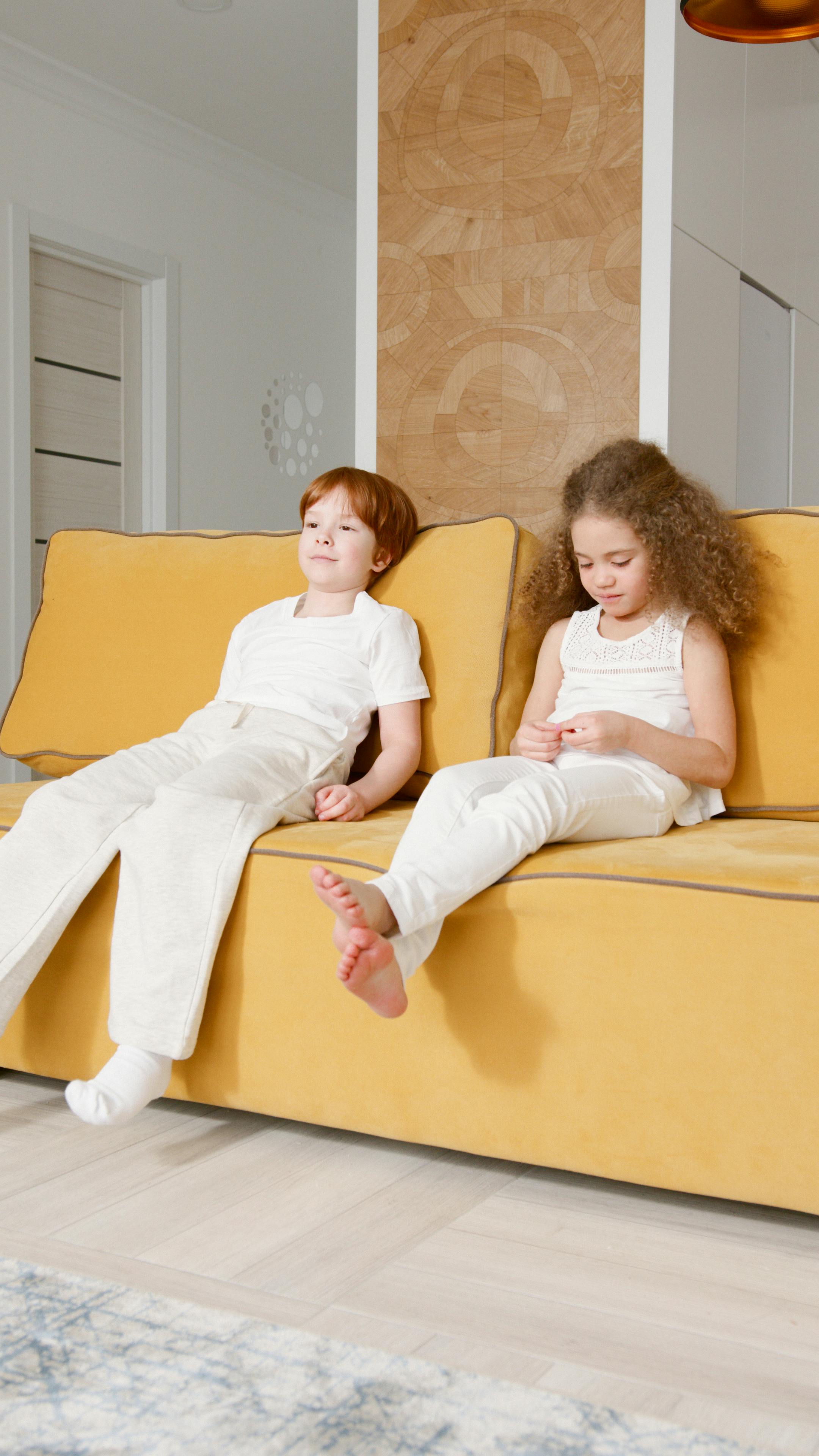 A Handsome Boy Sitting on the Chair · Free Stock Photo