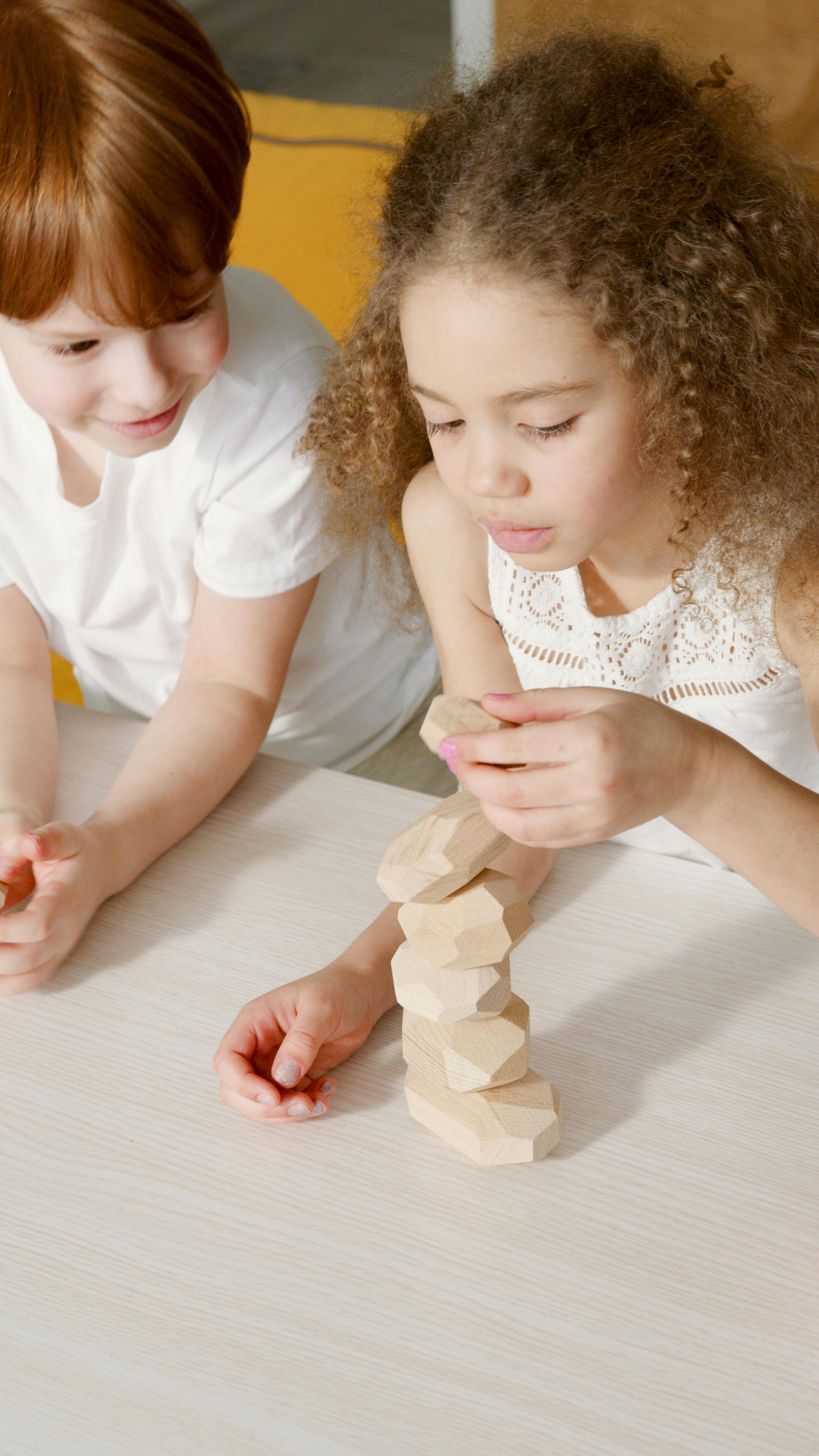 Children Playing with Balancing Wooden Blocks · Free Stock Photo